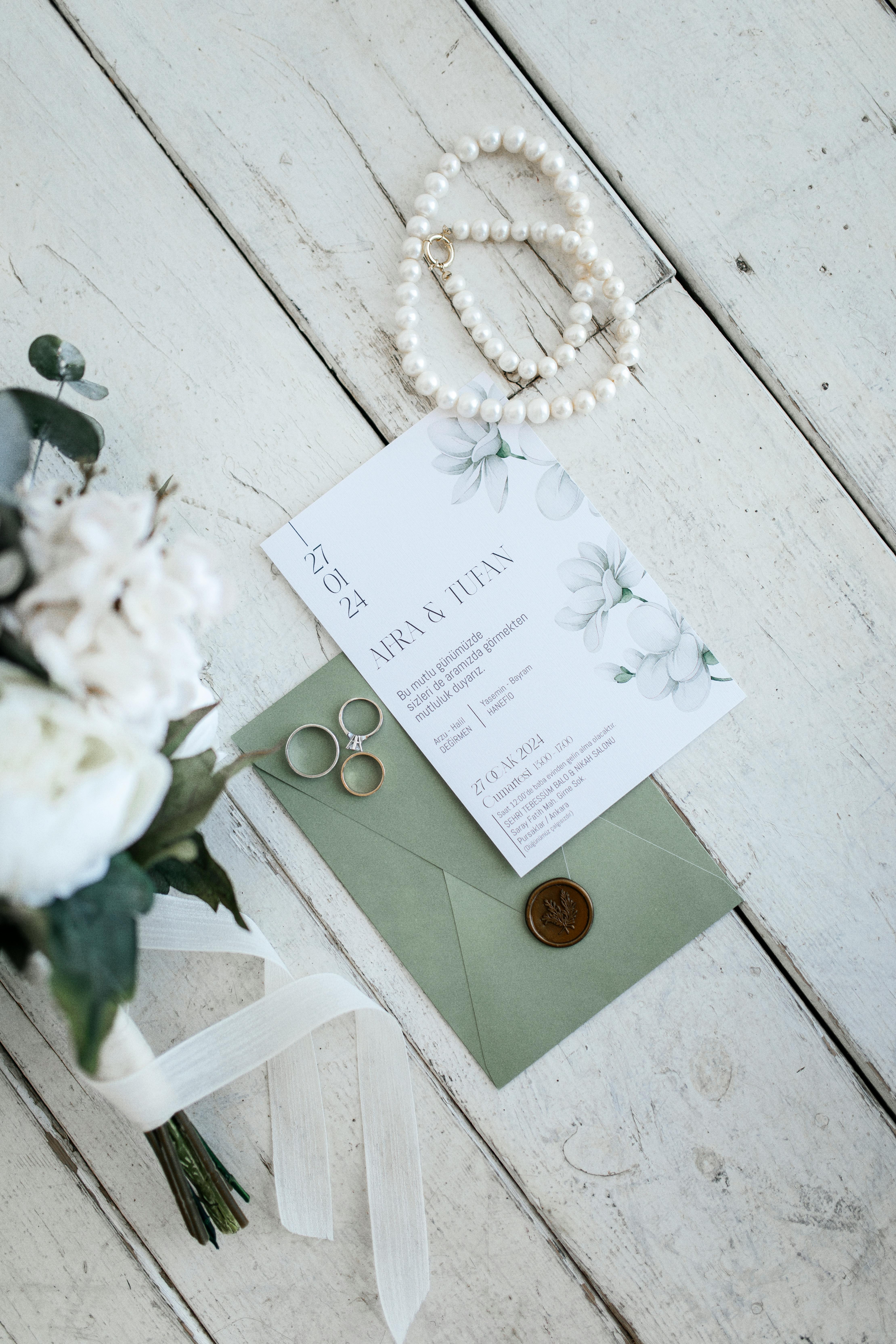 Rings and Wedding Invitation · Free Stock Photo
