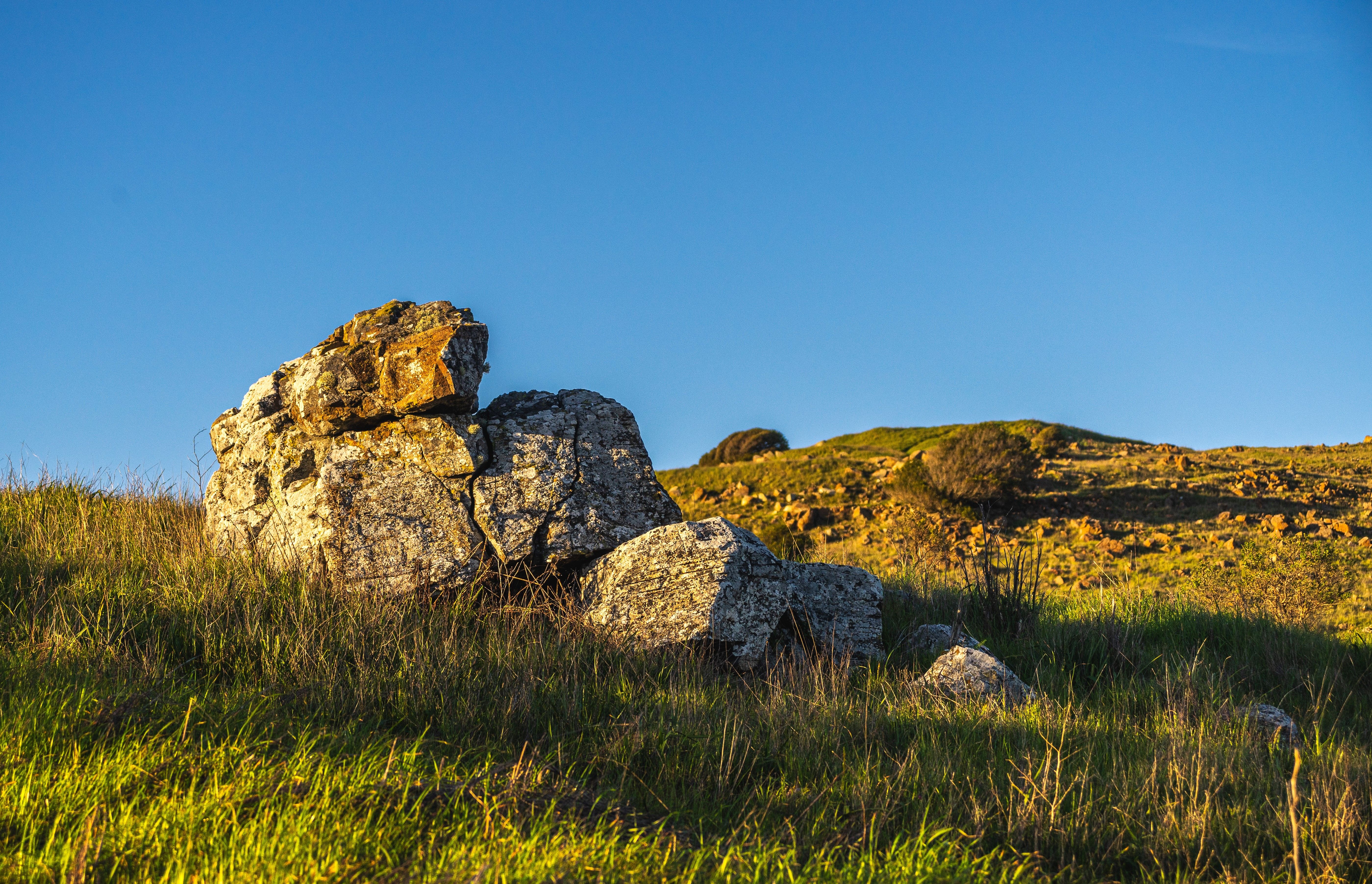 A large rock sitting on top of a hill · Free Stock Photo