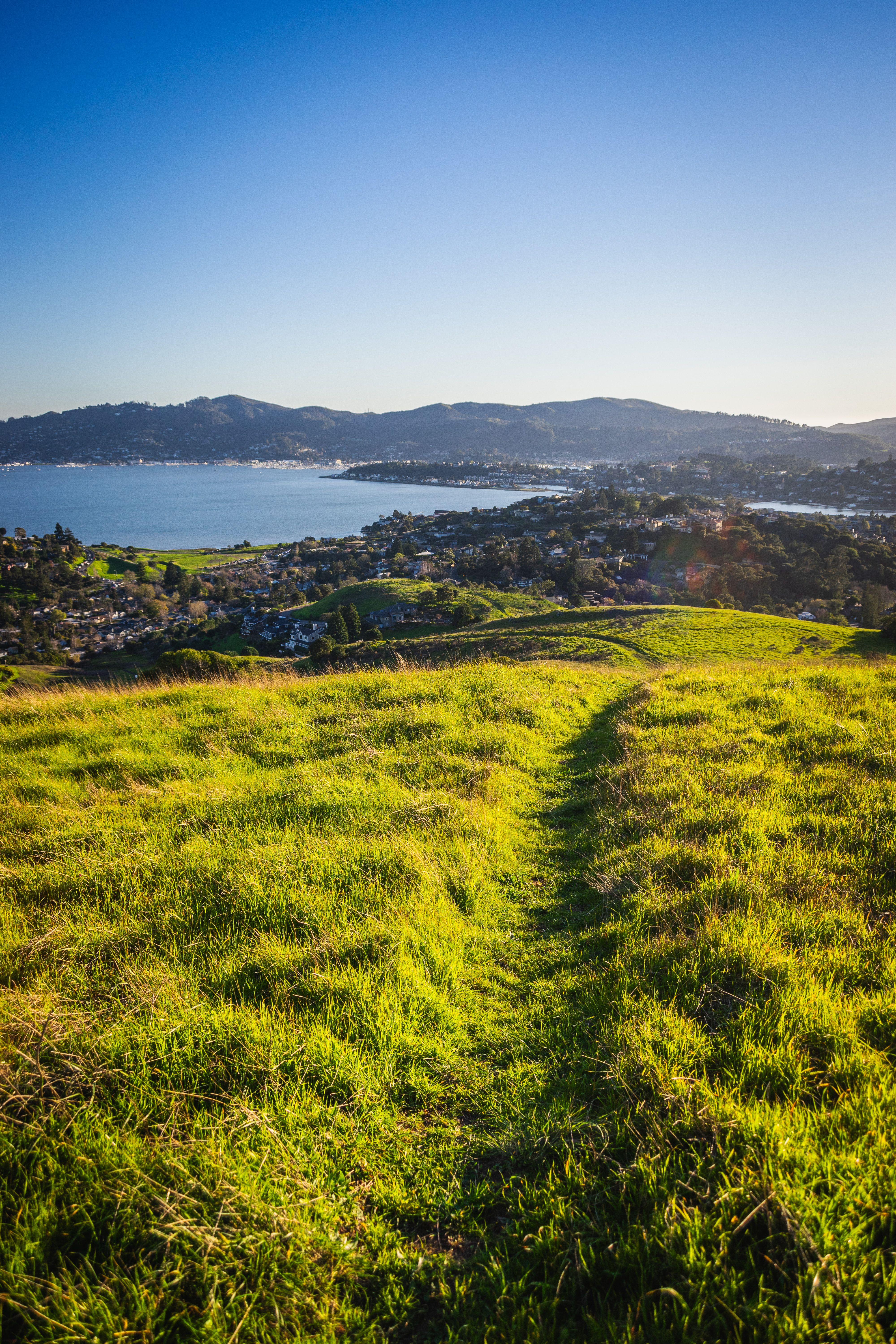 Clear Sky over Countryside and Sea Coast · Free Stock Photo