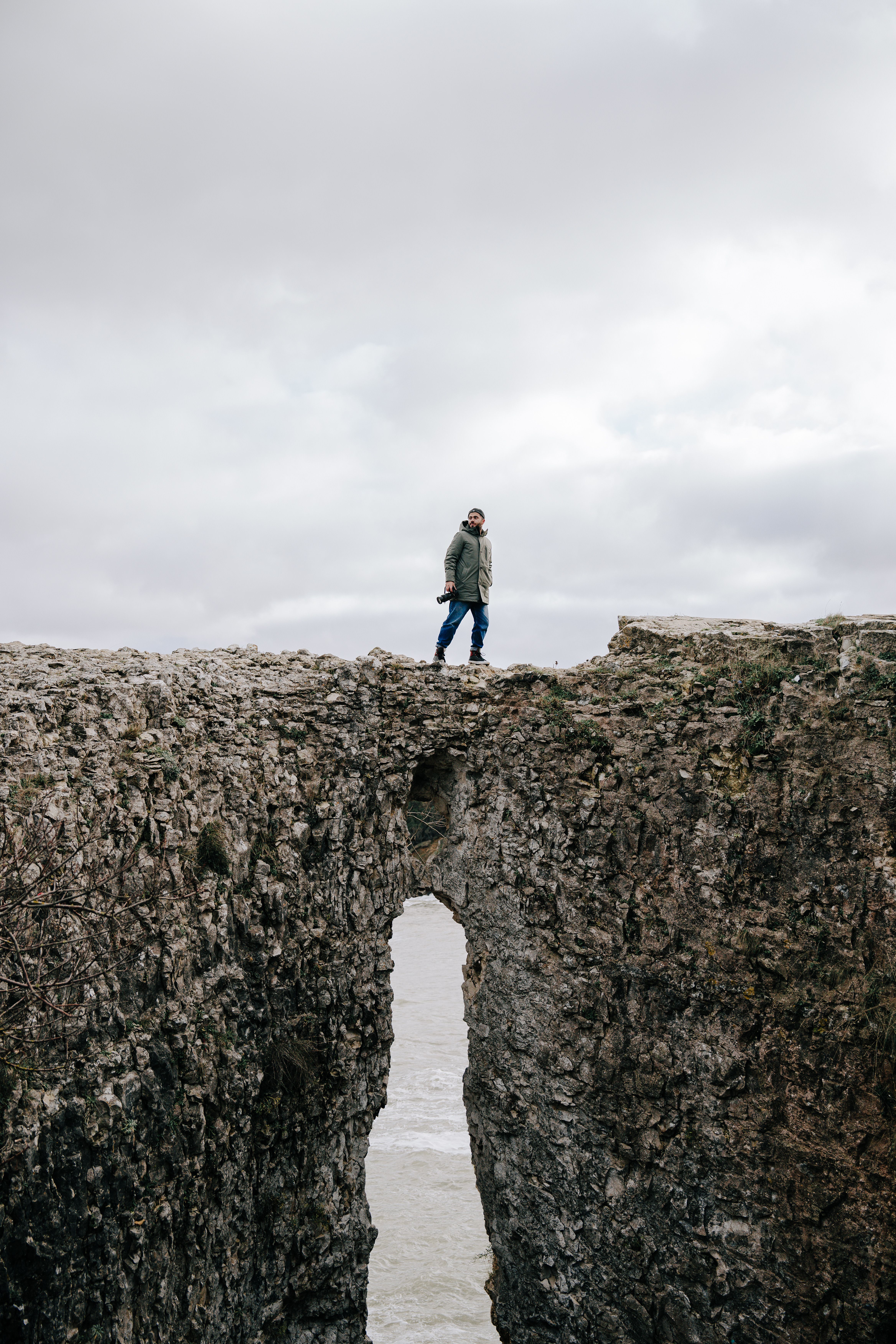Photography of a Person Standing on Cliff · Free Stock Photo