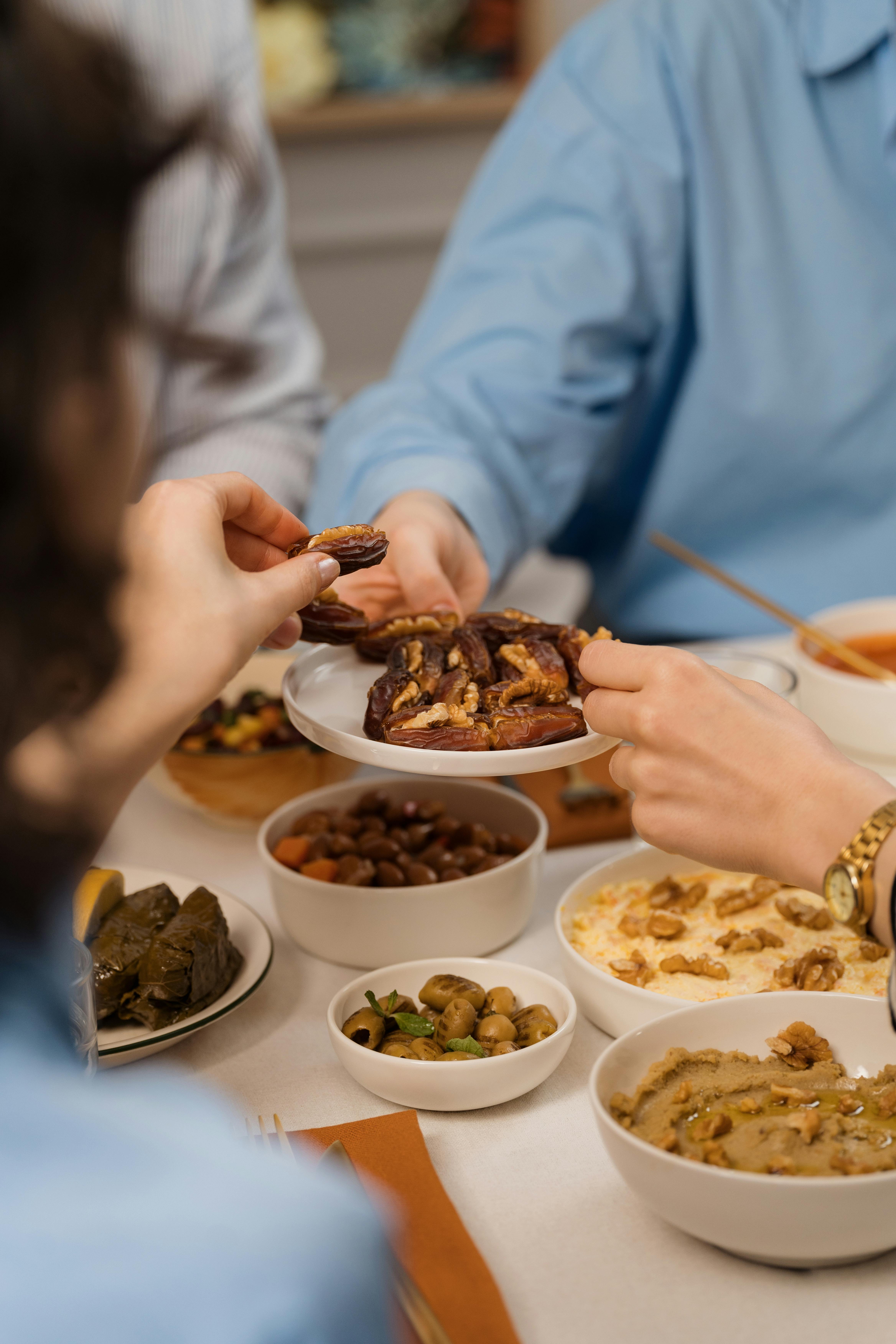 People Hands over Food on Table · Free Stock Photo