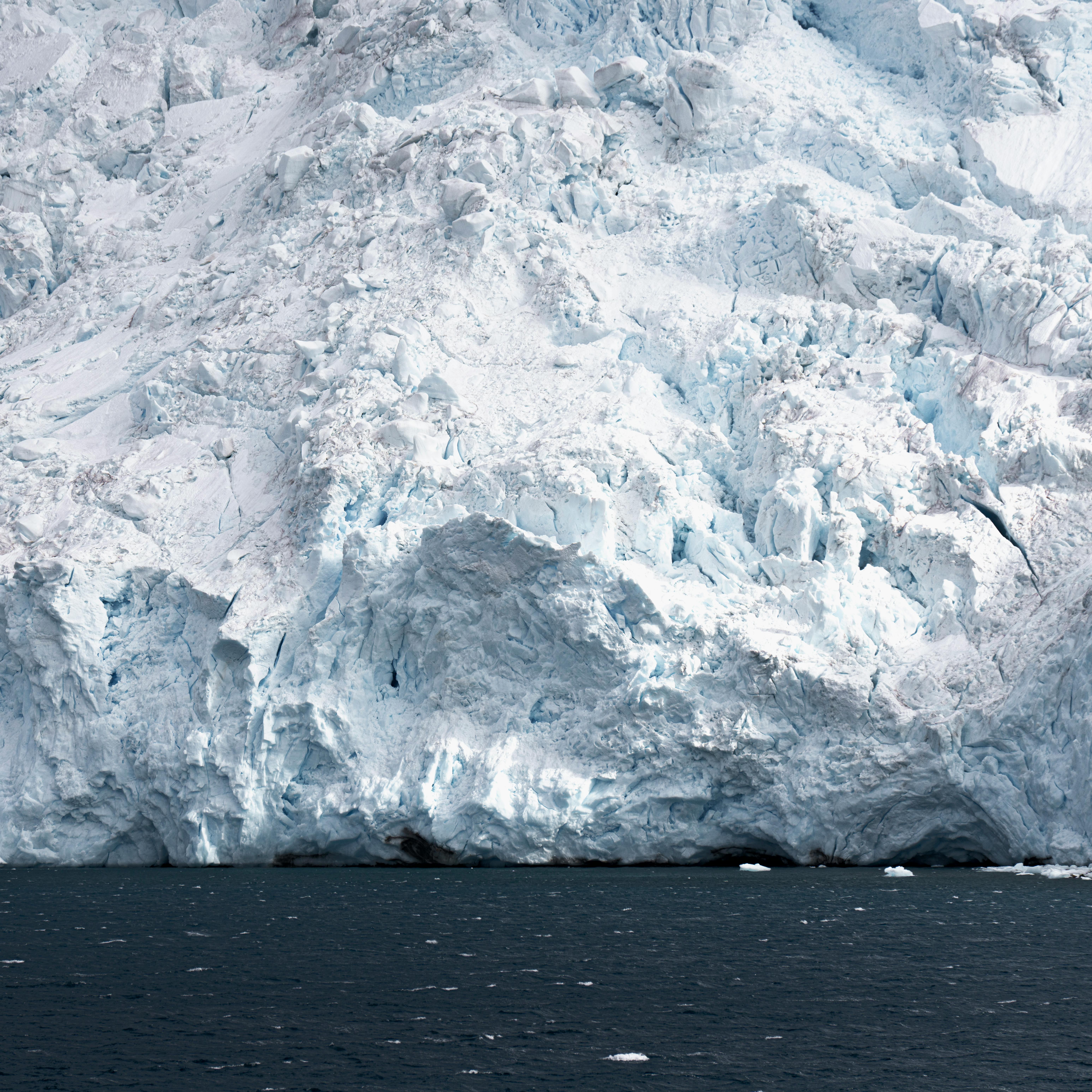 Close-up of an Iceberg and Ocean Shore · Free Stock Photo