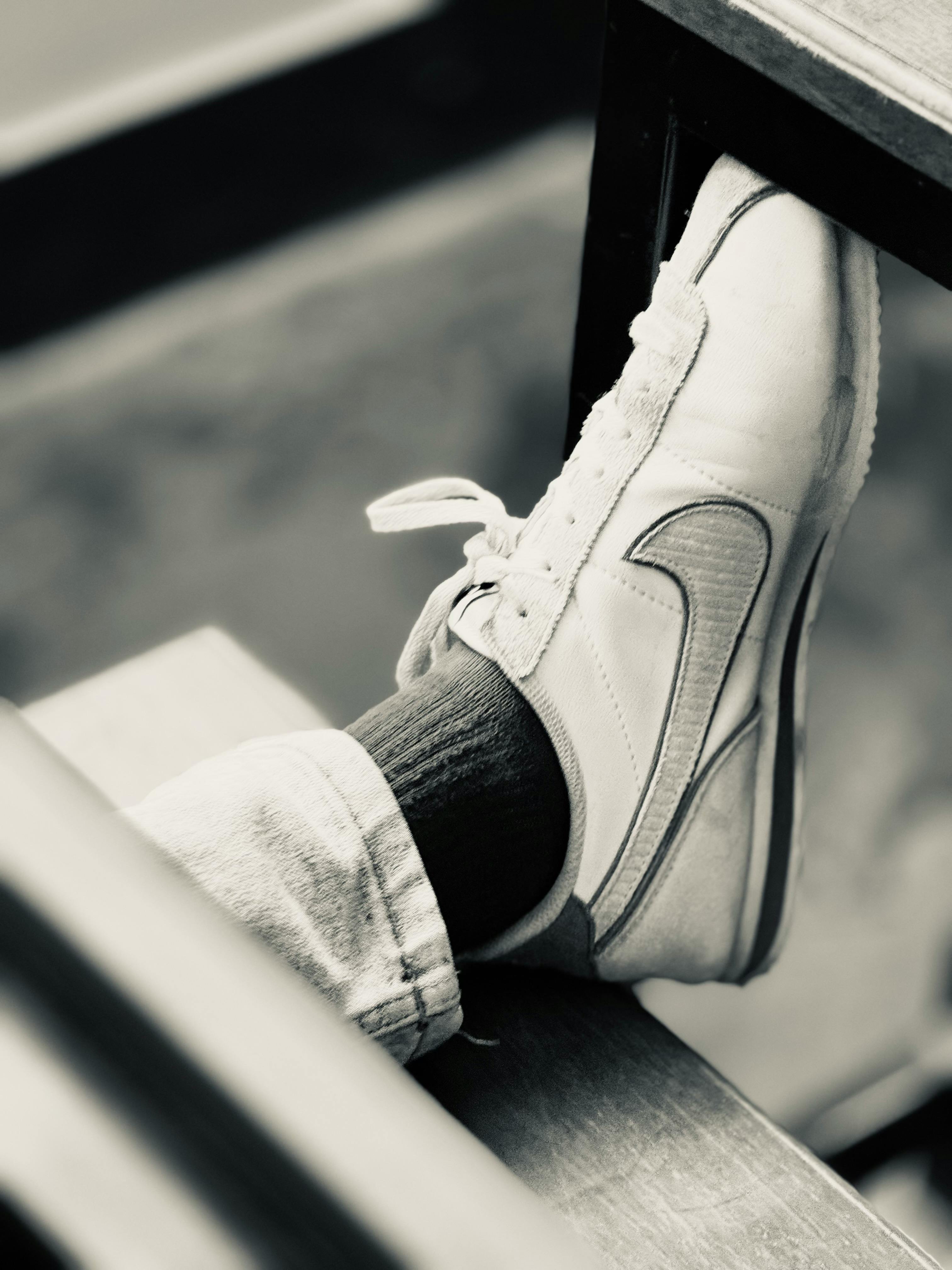 Close-up of a Nike Shoe on a Persons Foot · Free Stock Photo