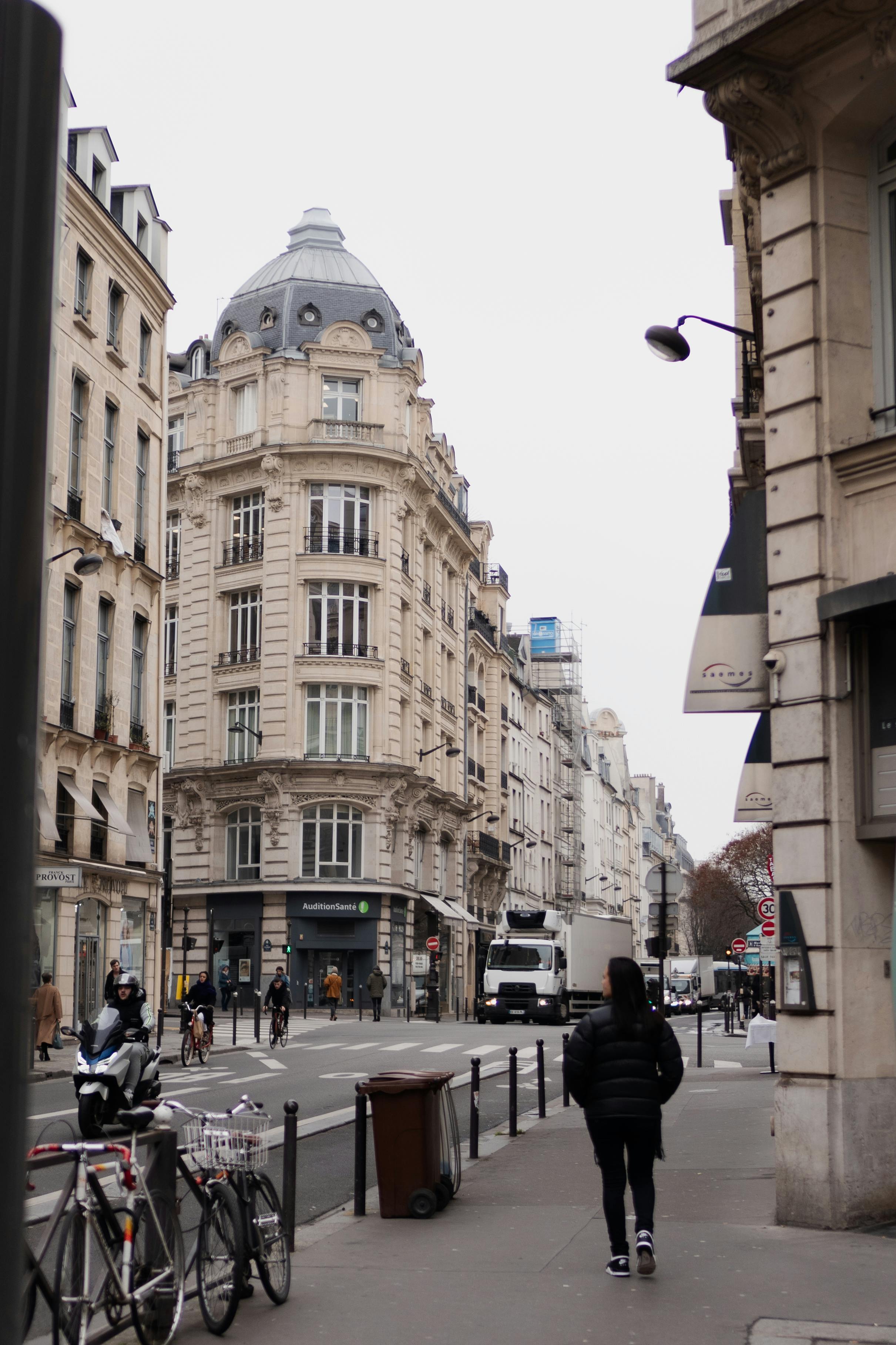 Back View of a Person Walking in Paris · Free Stock Photo