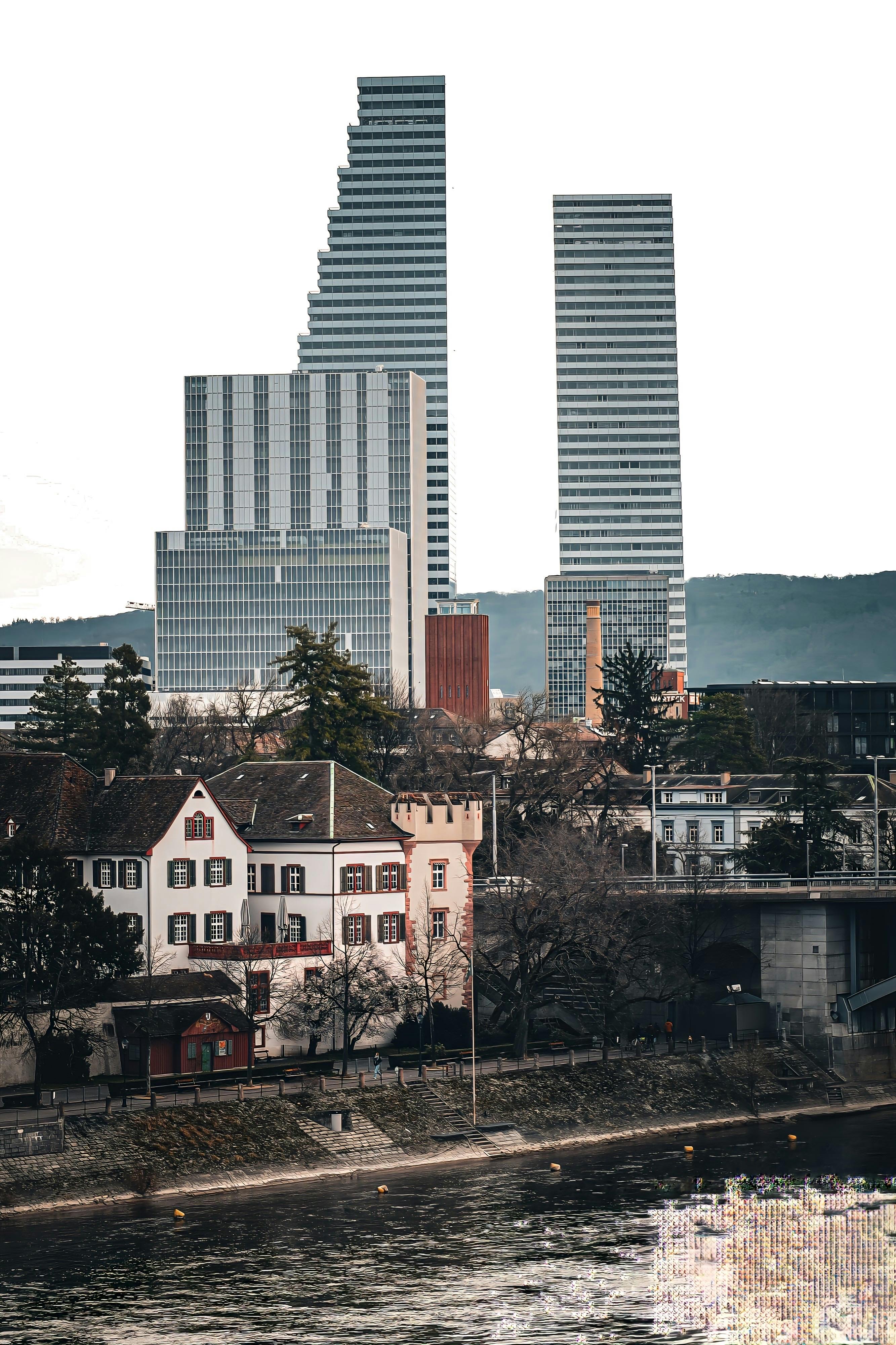 Roche Tower Skyscraper behind River and Buildings in Basel in ...
