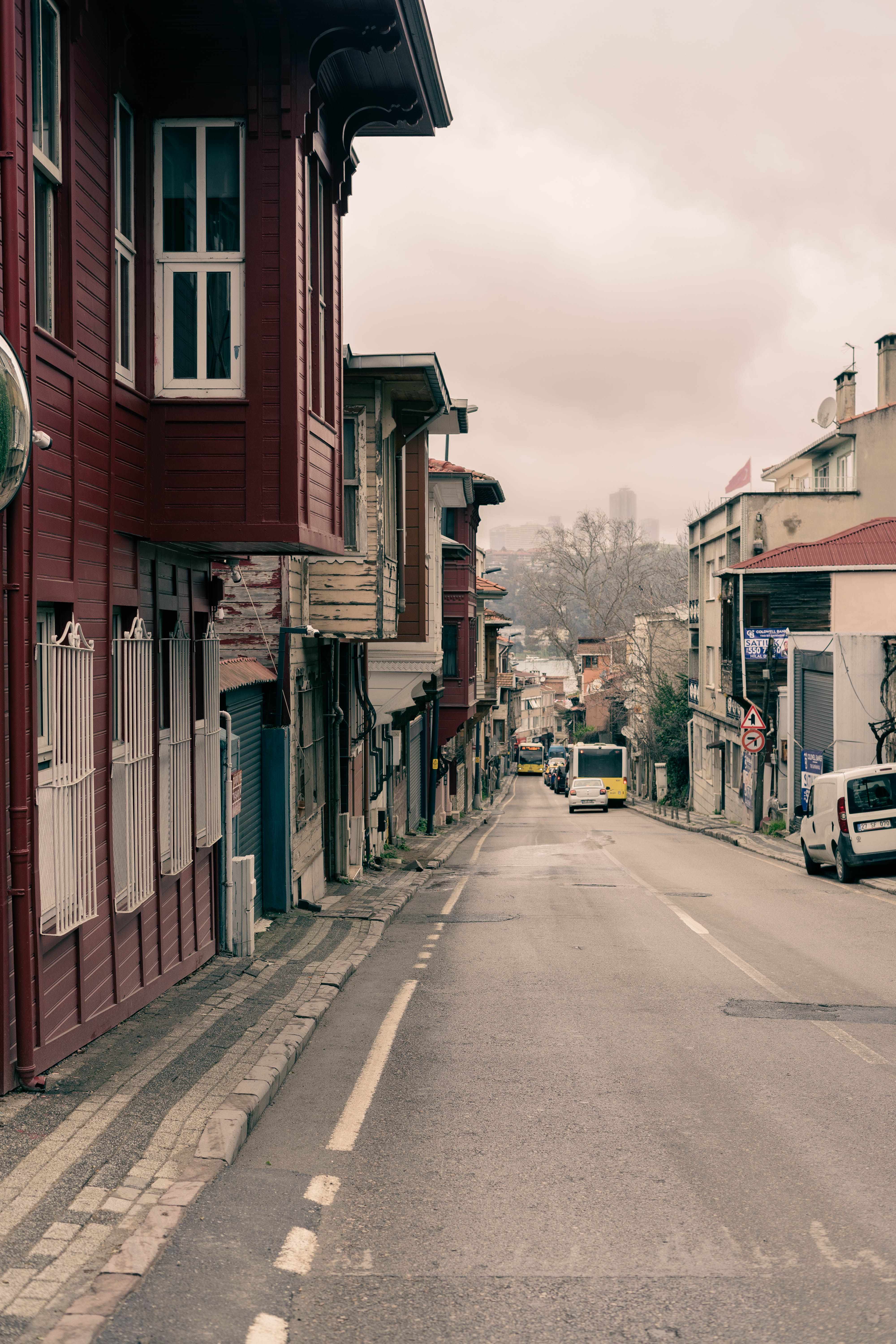 View of a Street between Houses in City · Free Stock Photo