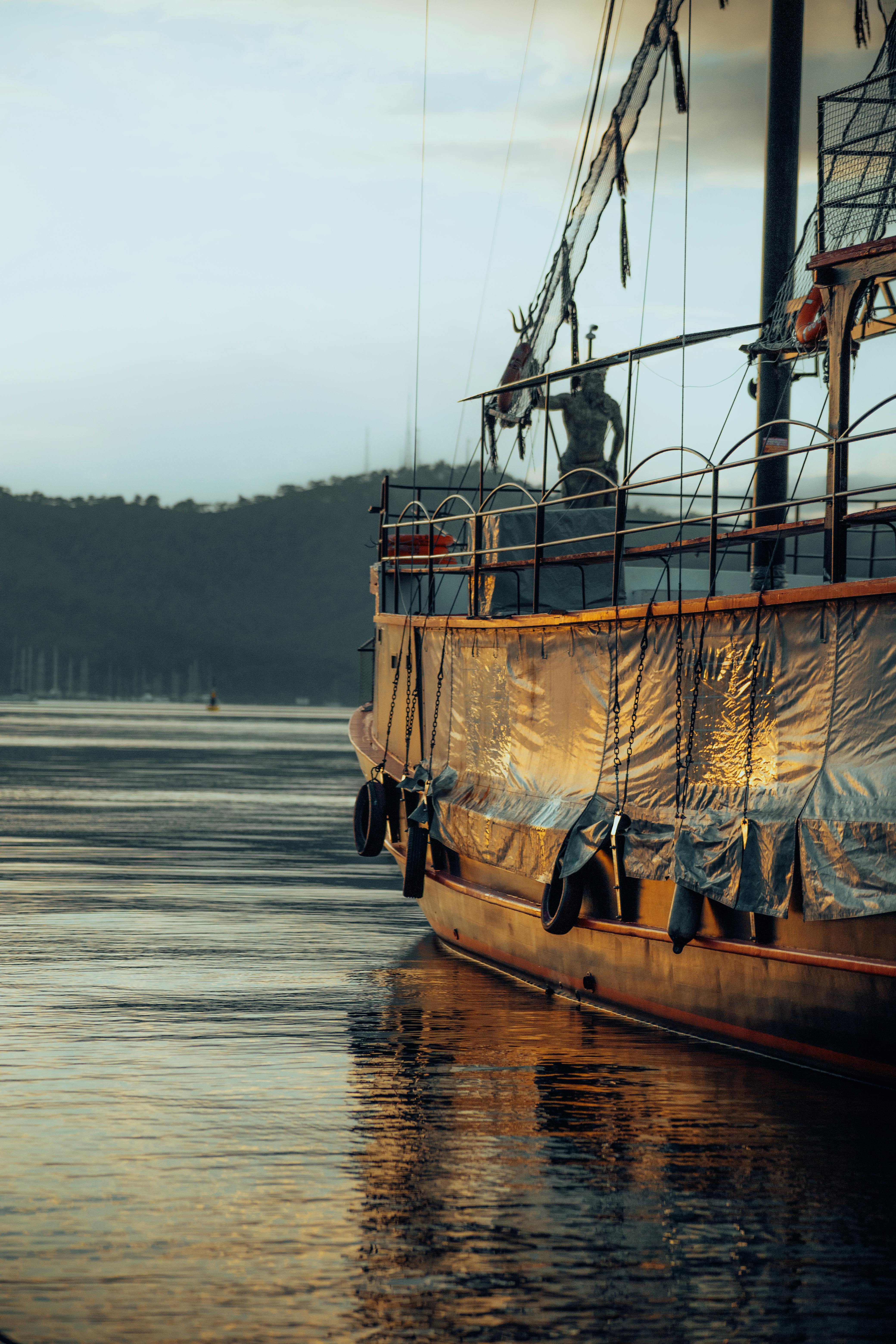 View of an Old Ship Moored on a Shore of a Body of Water · Free Stock Photo