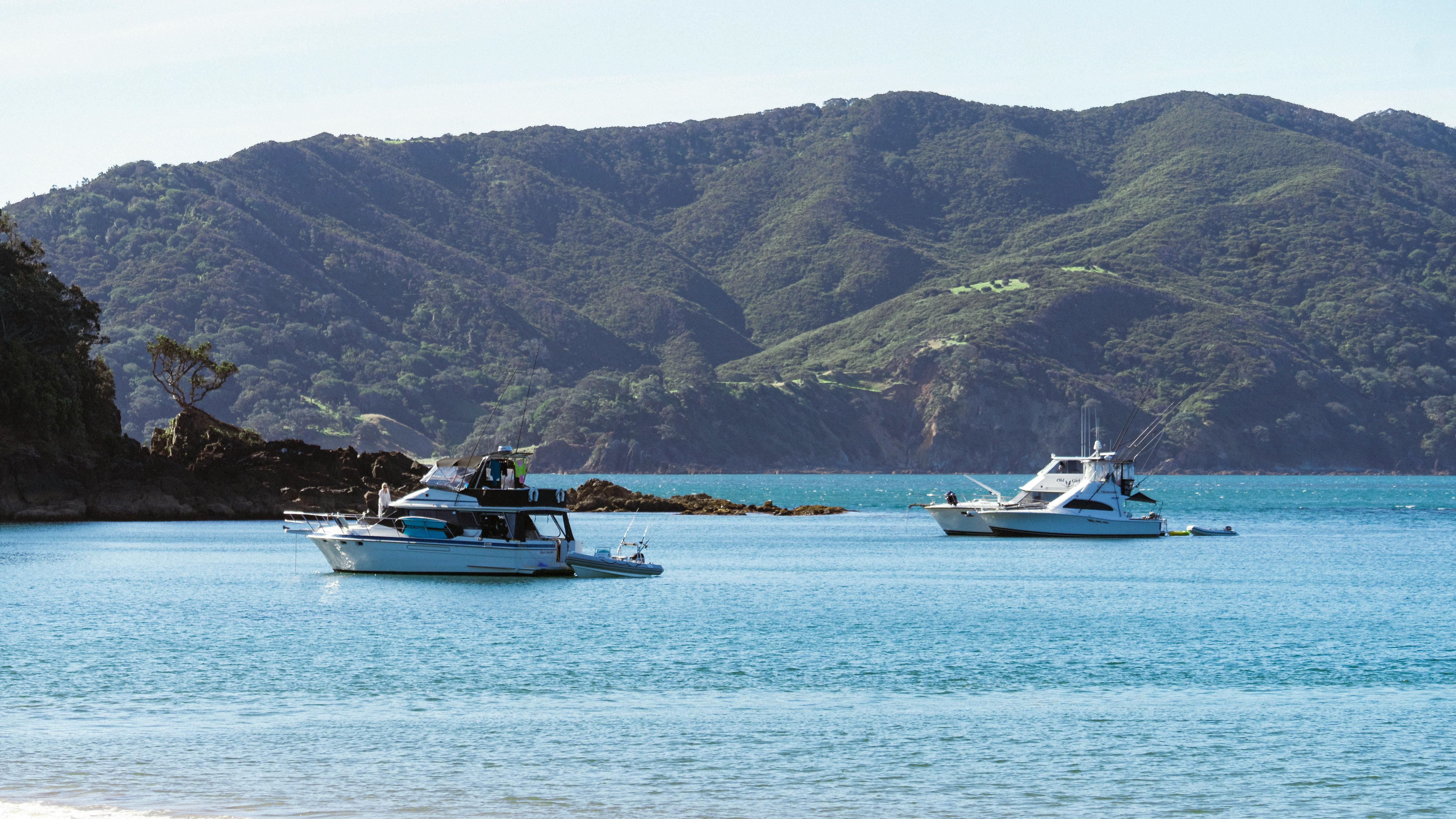 Two Motorboats on a Sea by the Mountains · Free Stock Photo