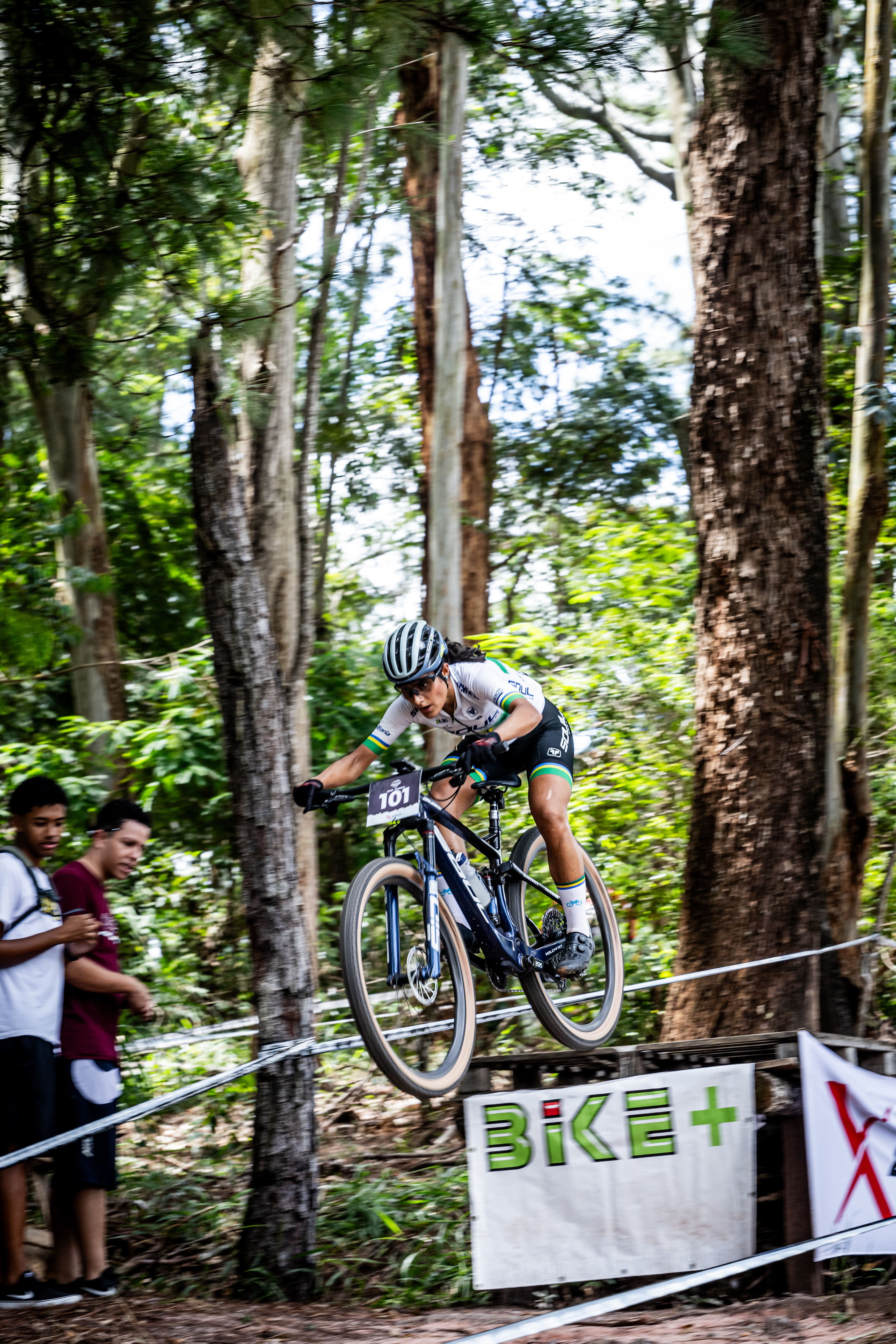 Cyclist Jumping on a Bike During a Race · Free Stock Photo