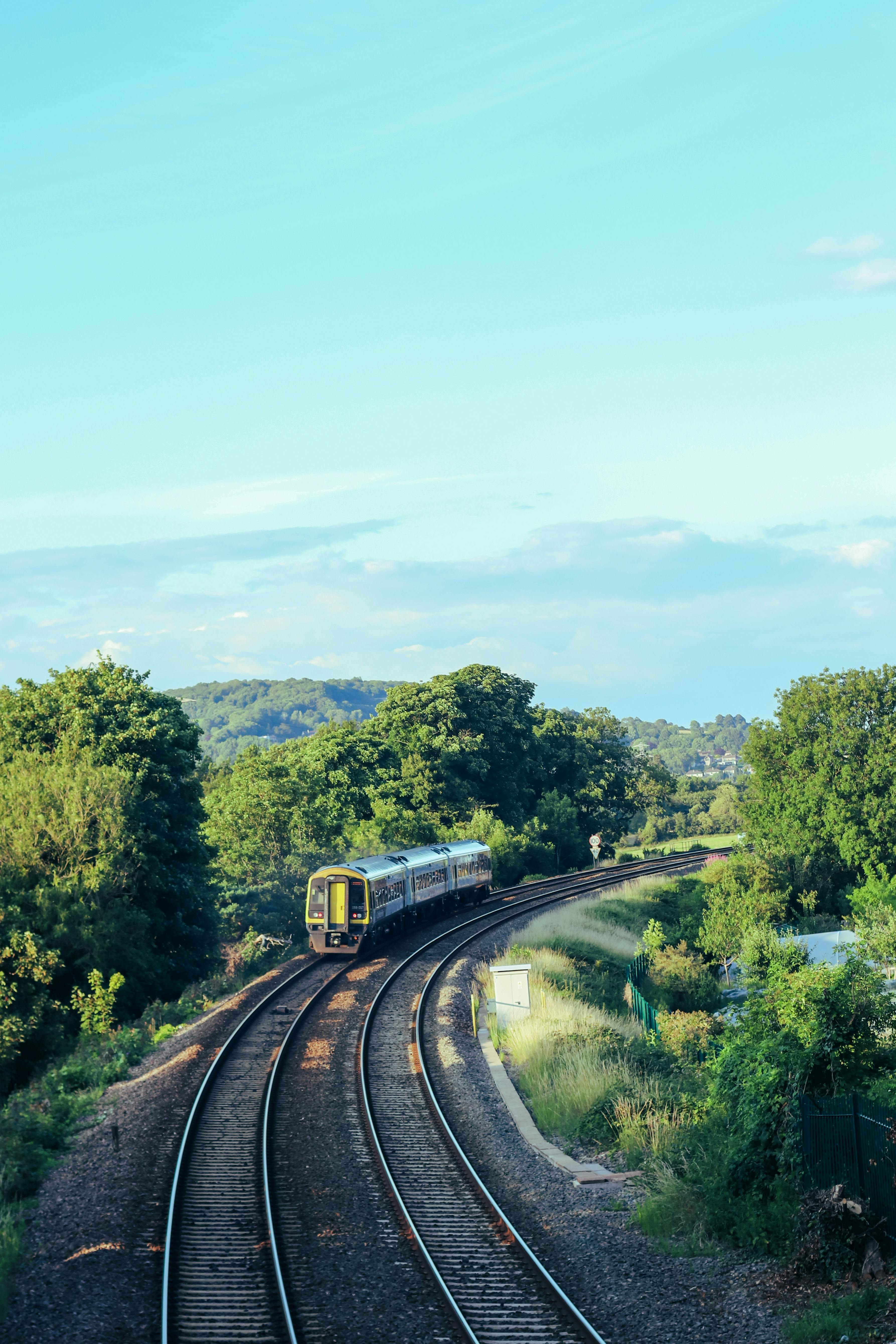 Photo Of Railway On Mountain Near Houses · Free Stock Photo