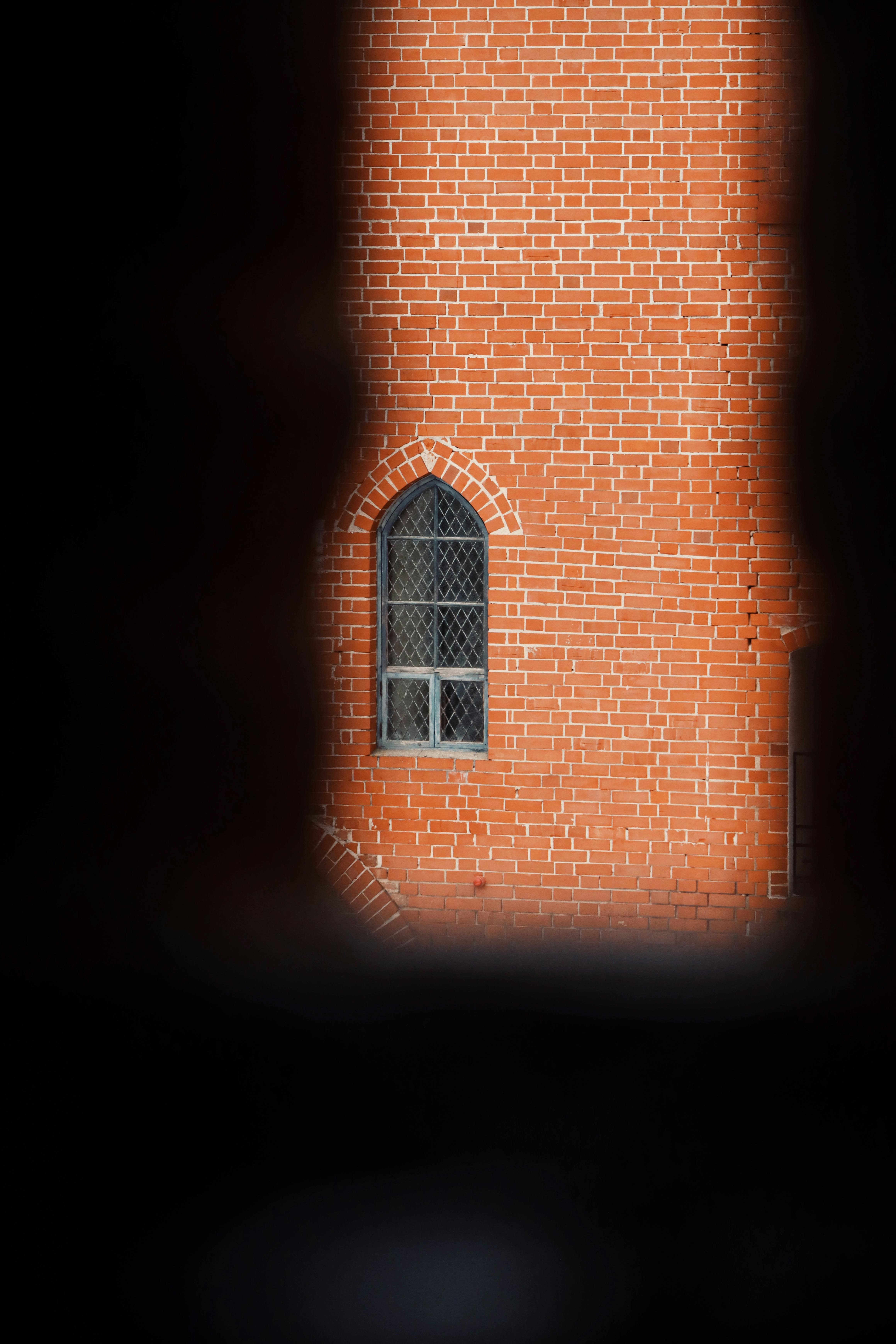 Window in a Brick Building in Shadow · Free Stock Photo