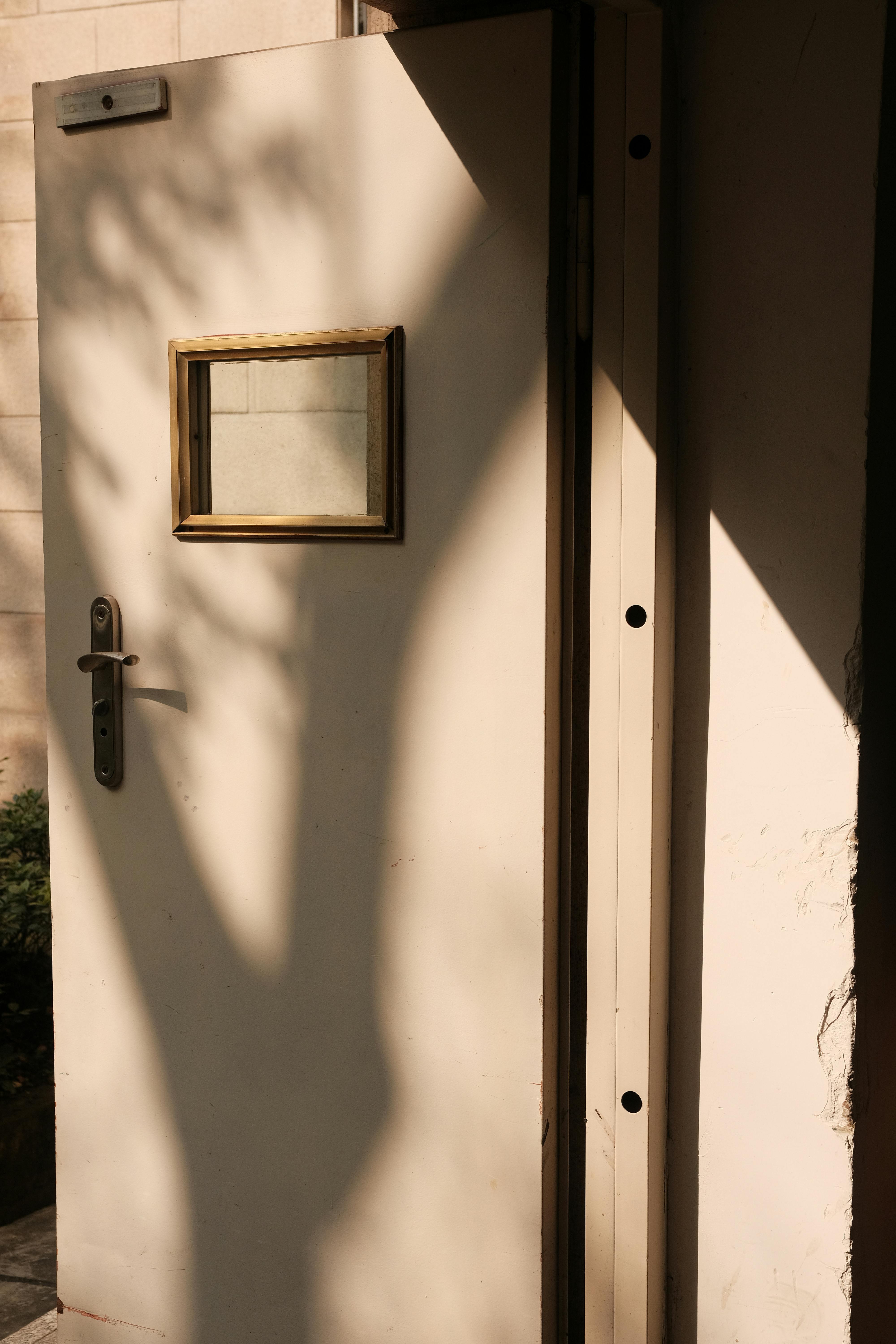 Sunlight and Shadow on Open Door · Free Stock Photo