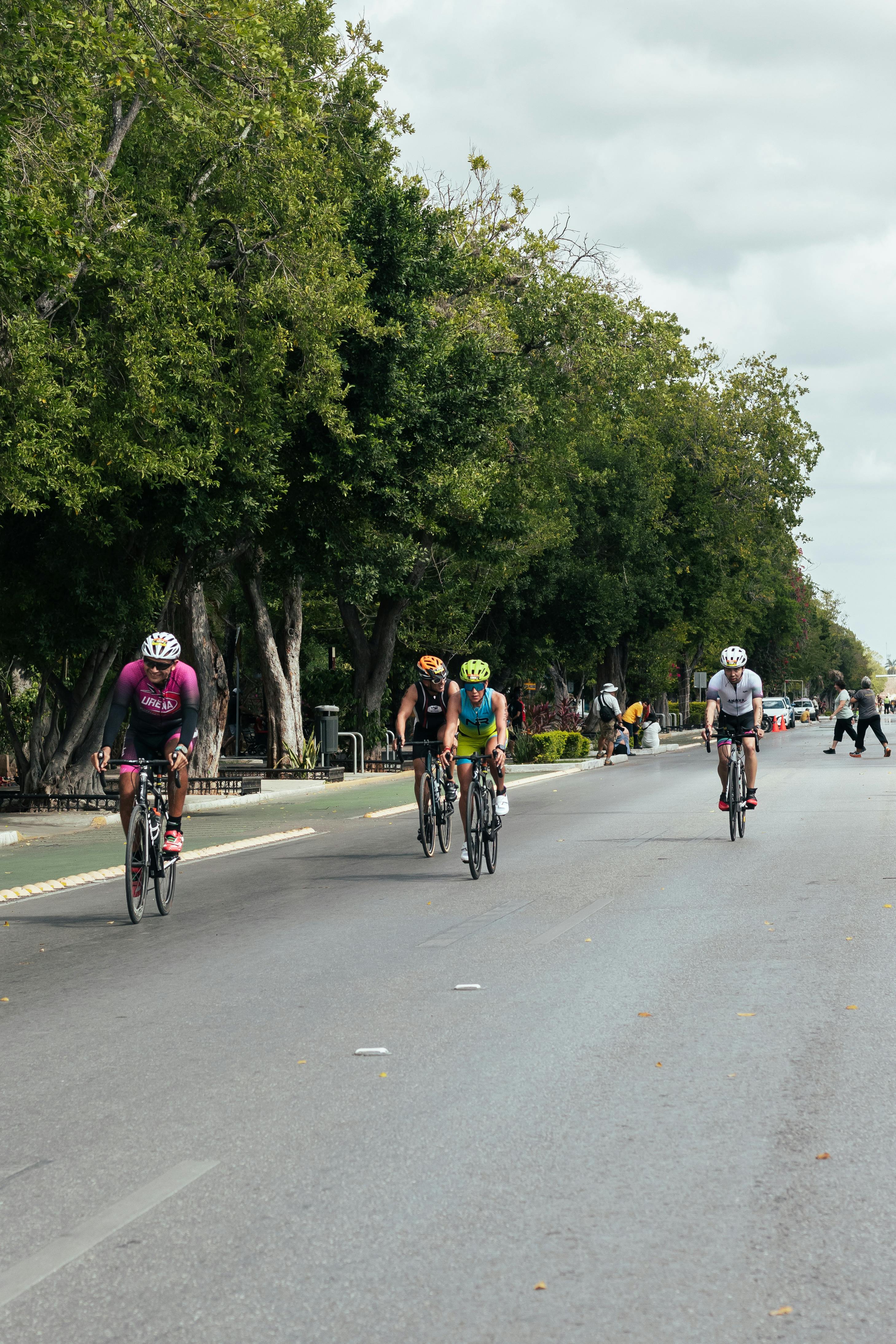 People Riding on Bikes on a Street · Free Stock Photo