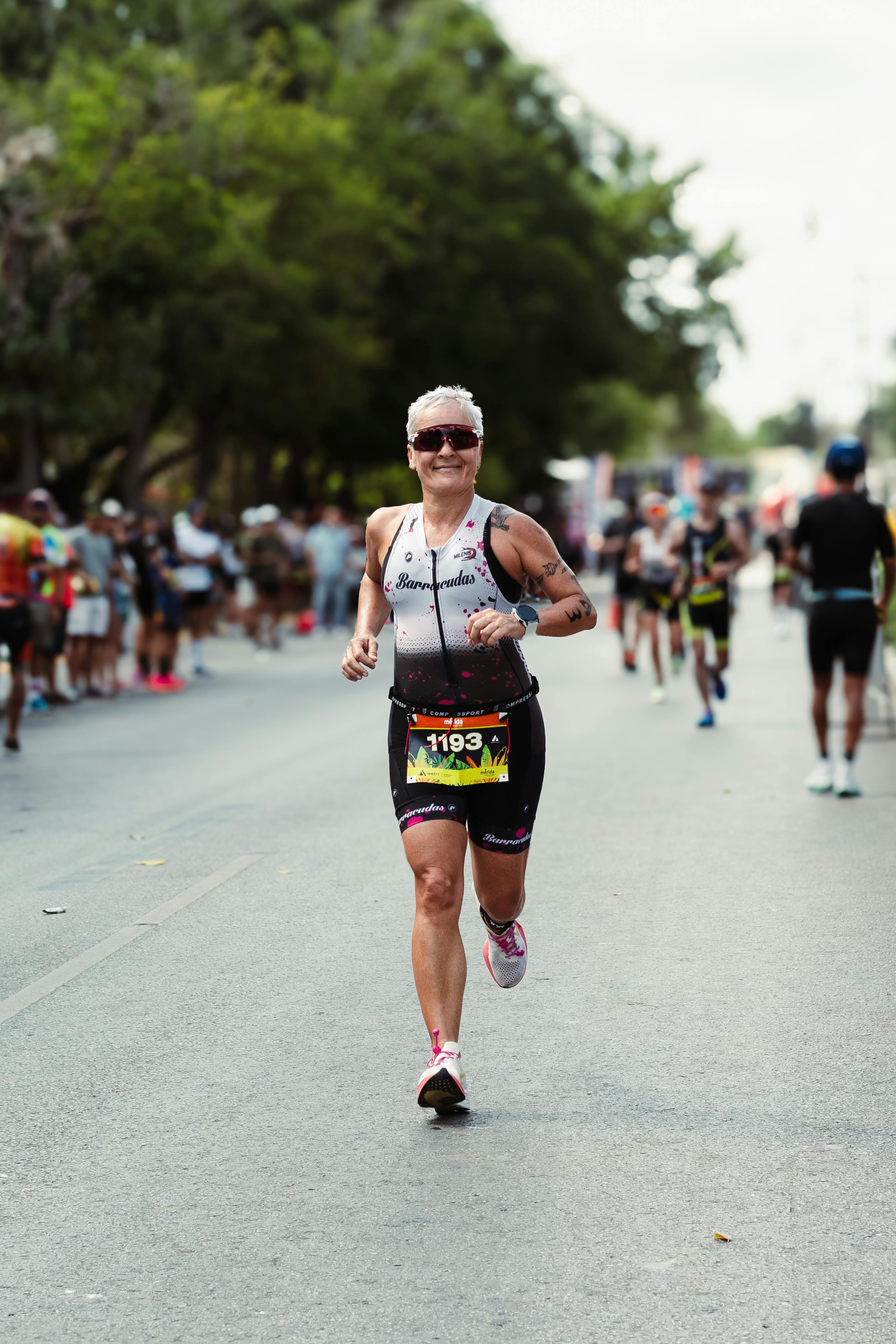 Photo of a Woman Running a Marathon · Free Stock Photo