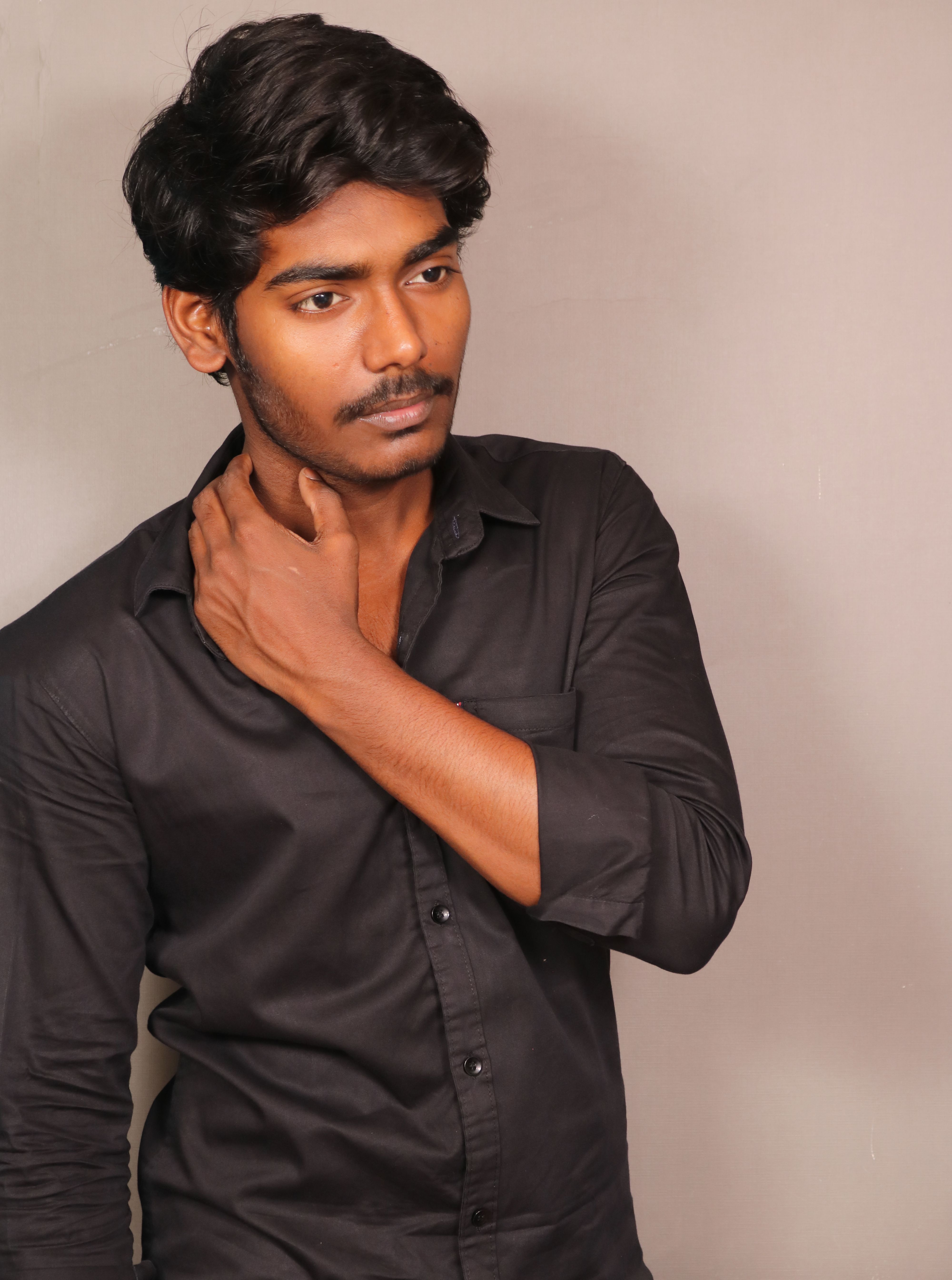 Man in Black Shirt Holding Hand on Neck · Free Stock Photo