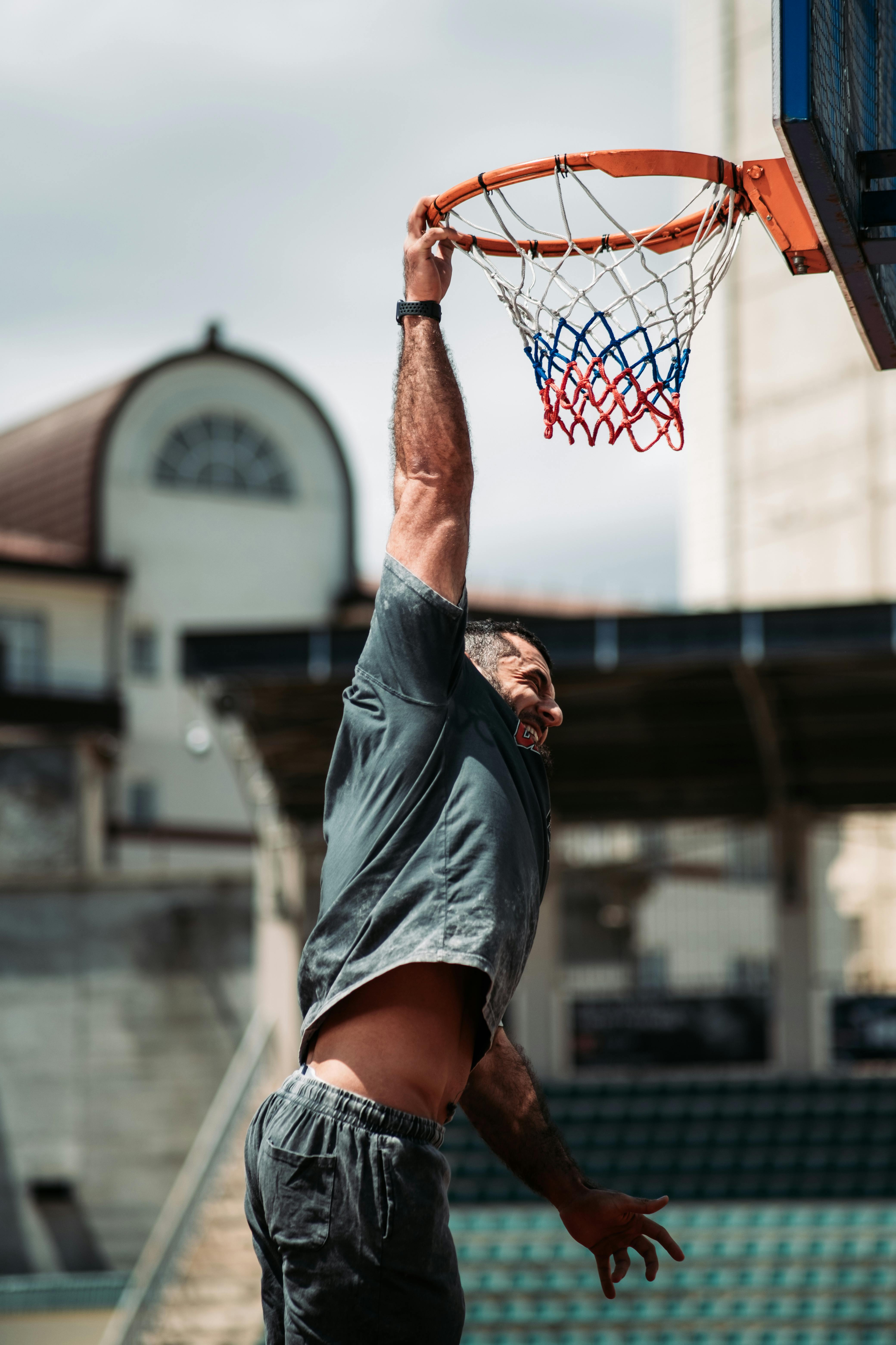 Woman Lying on Basketball Free Throw Line · Free Stock Photo