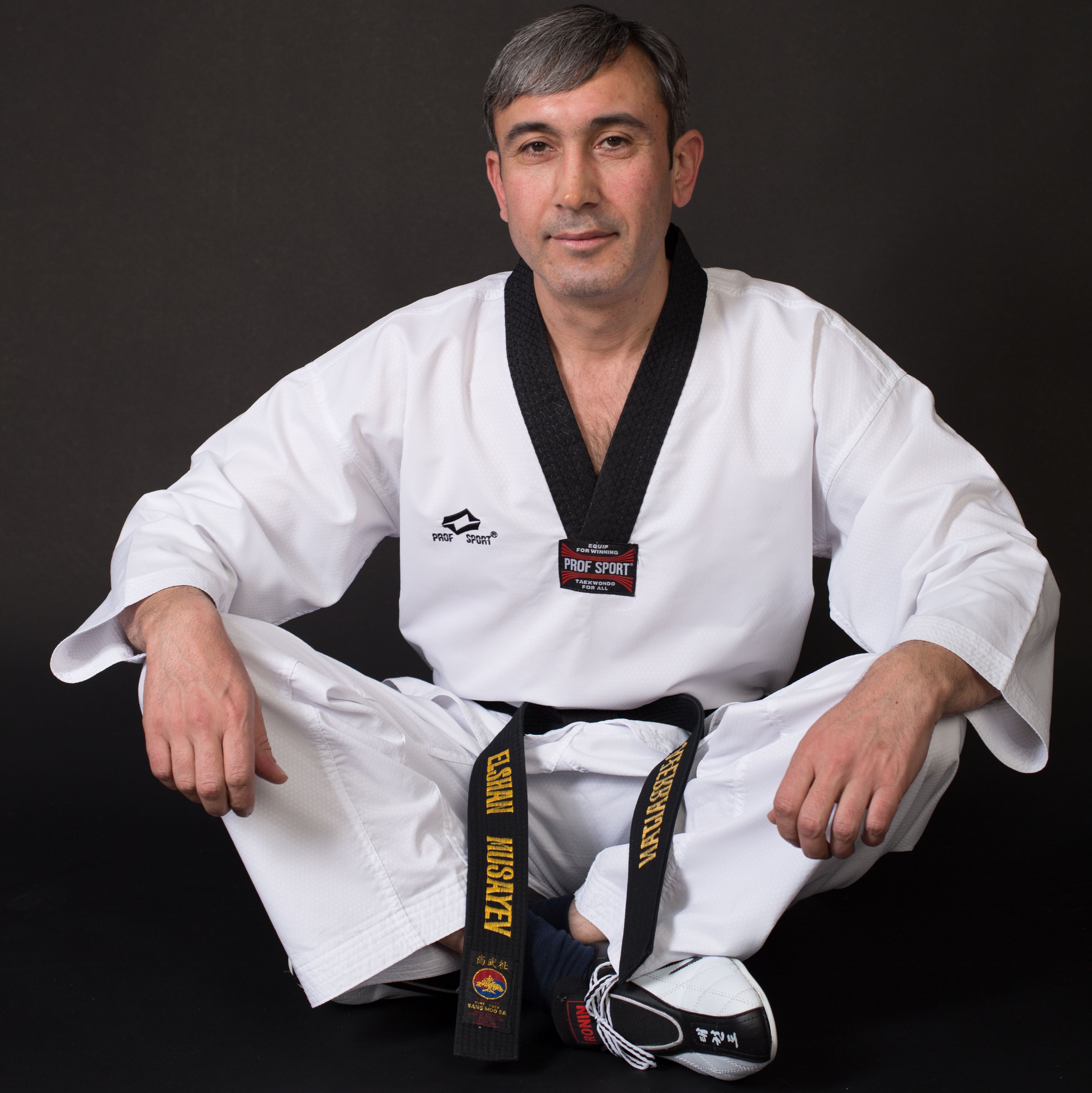 Man Squatting in Karate Kimono · Free Stock Photo
