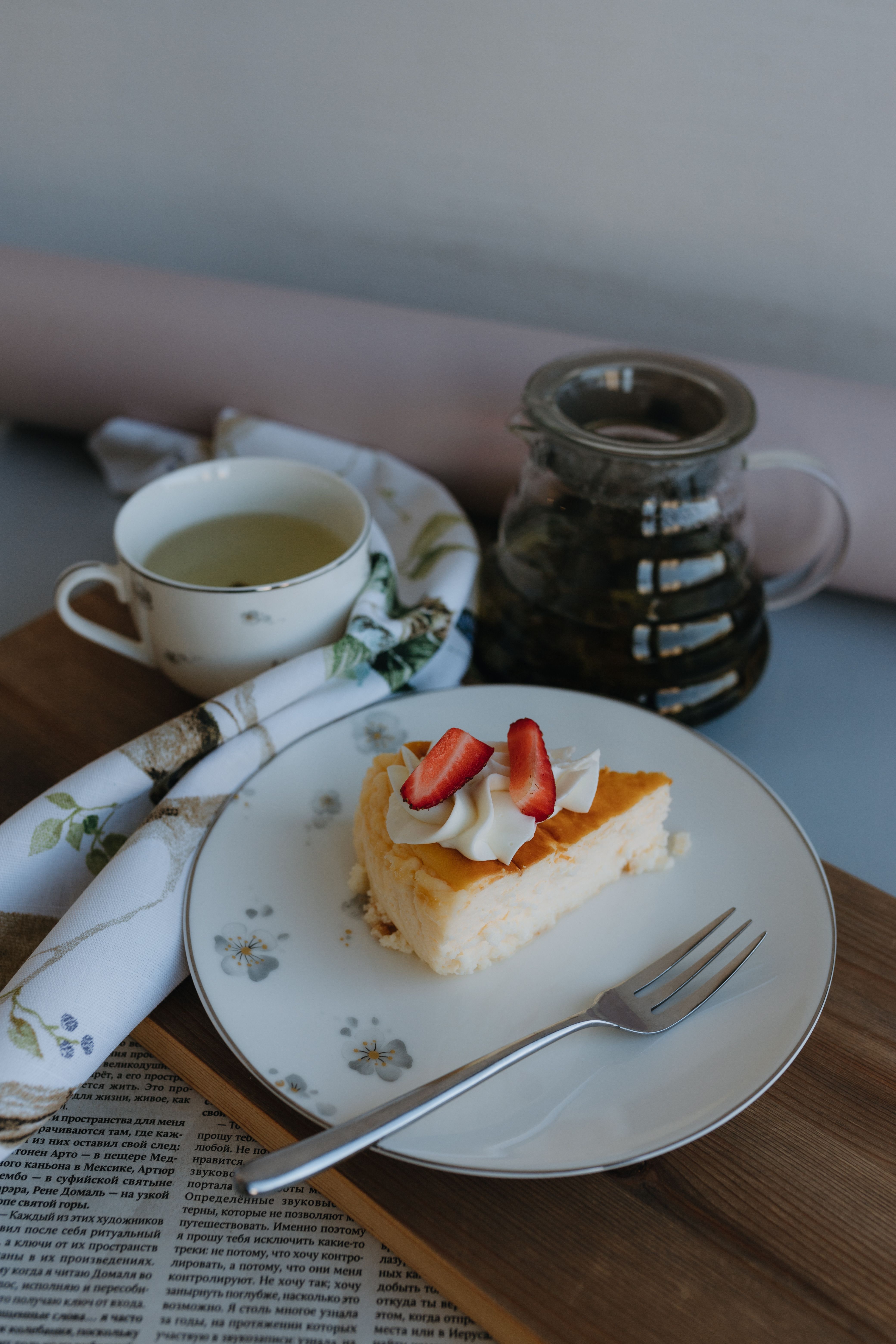 A Slice of Cheesecake and a Cup of Tea Standing on a Table · Free Stock ...