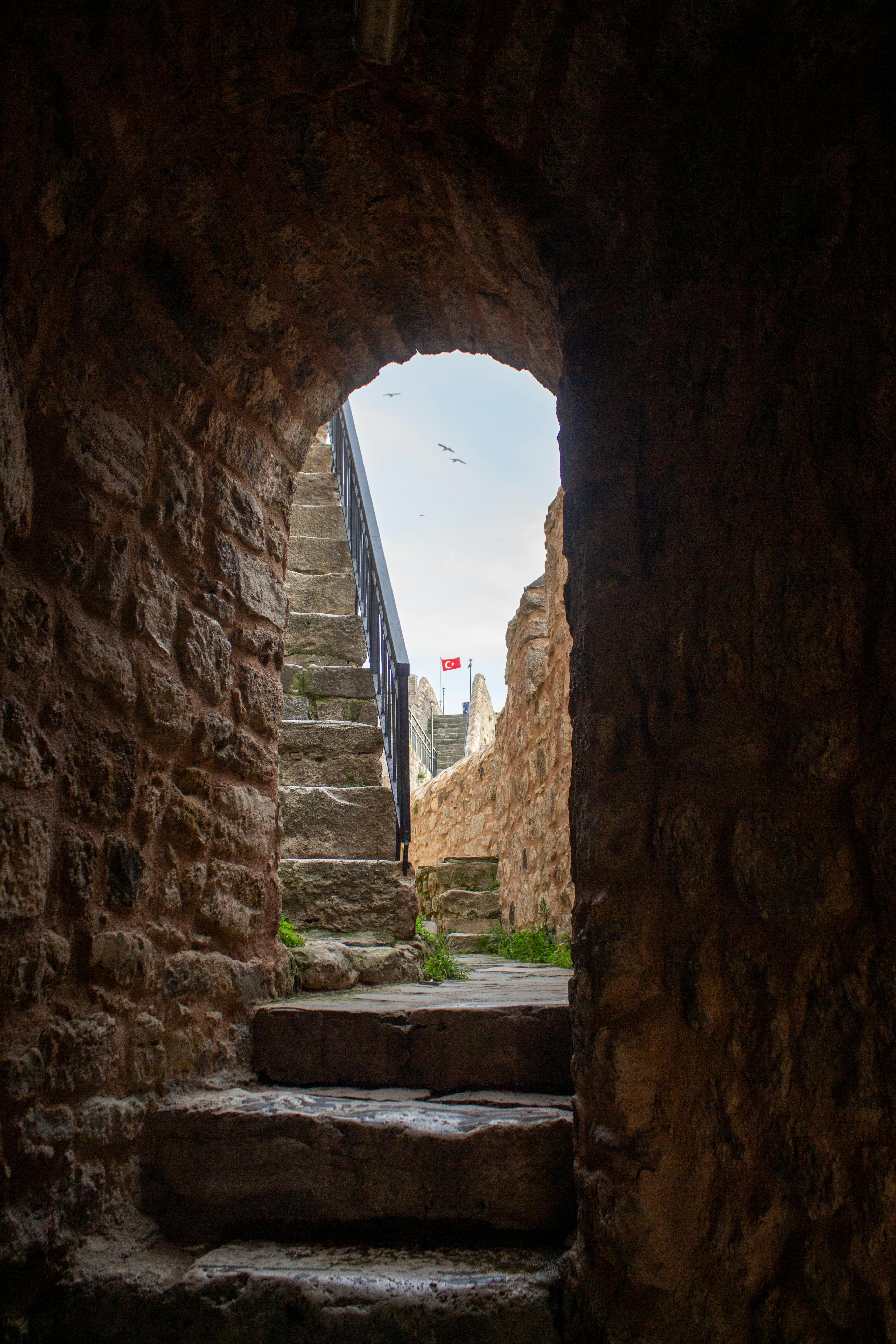 View of a Narrow Walkway between Stone Walls of a Castle · Free Stock Photo