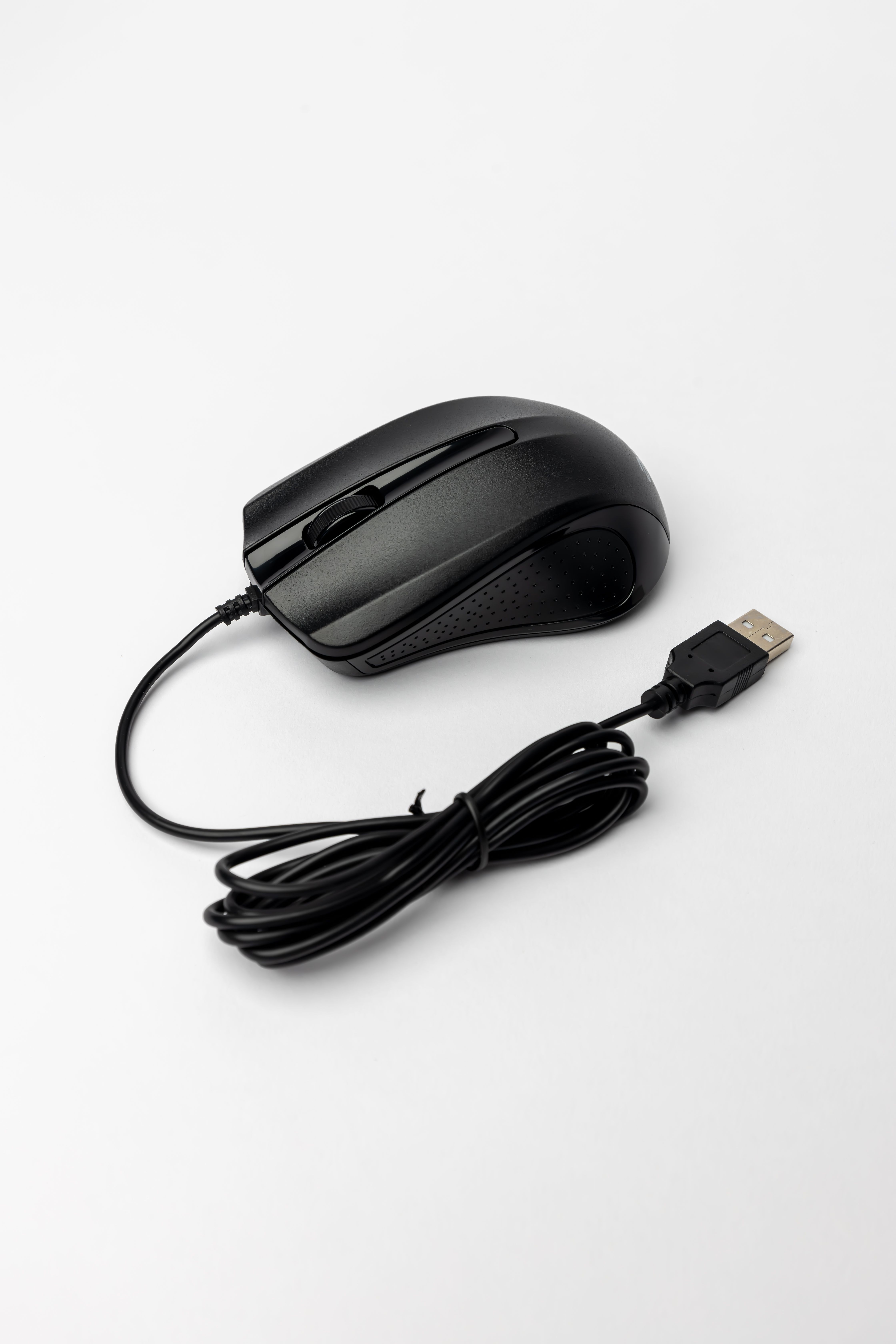 A black mouse with a cord attached to it · Free Stock Photo