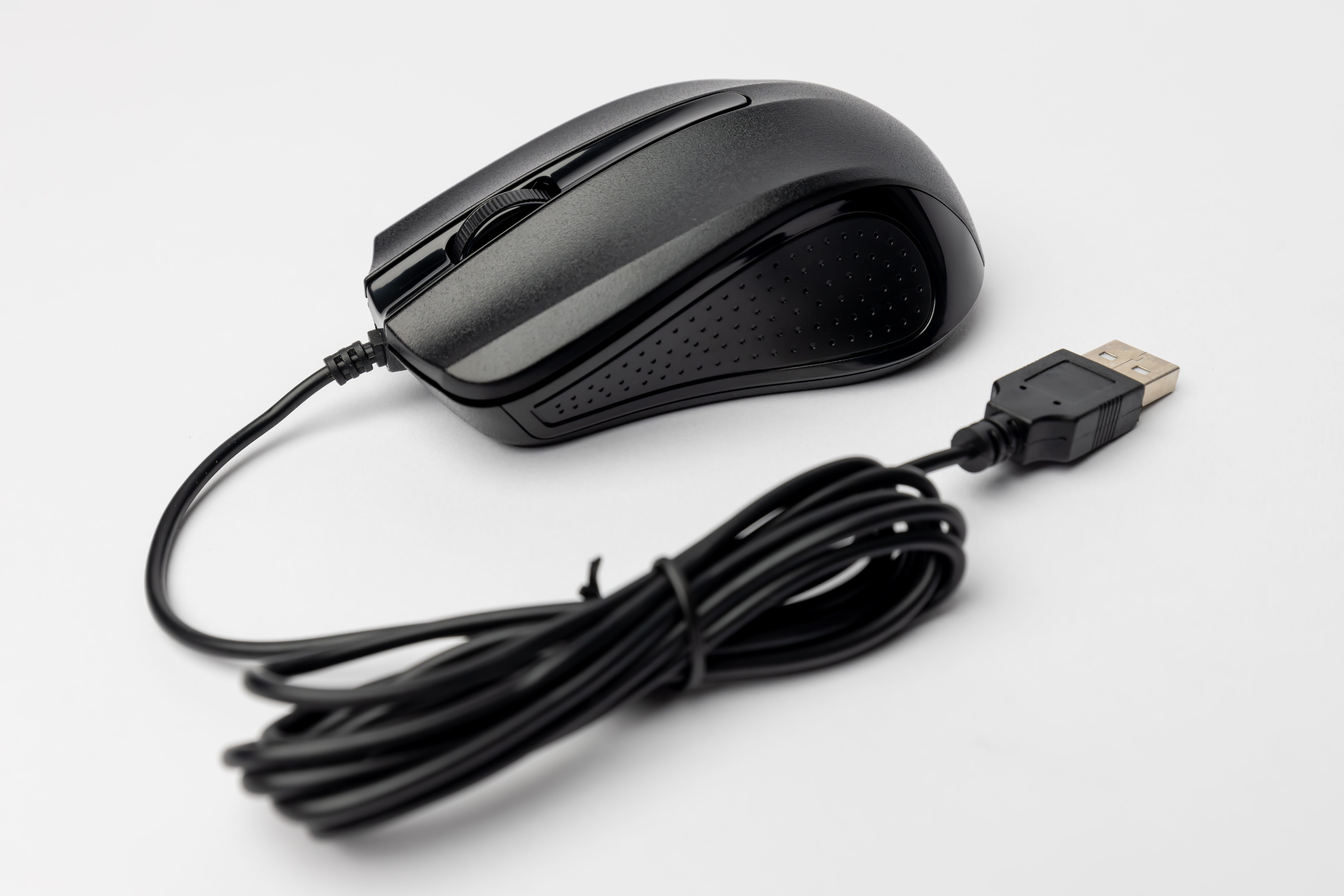 A black mouse with a cord attached to it · Free Stock Photo