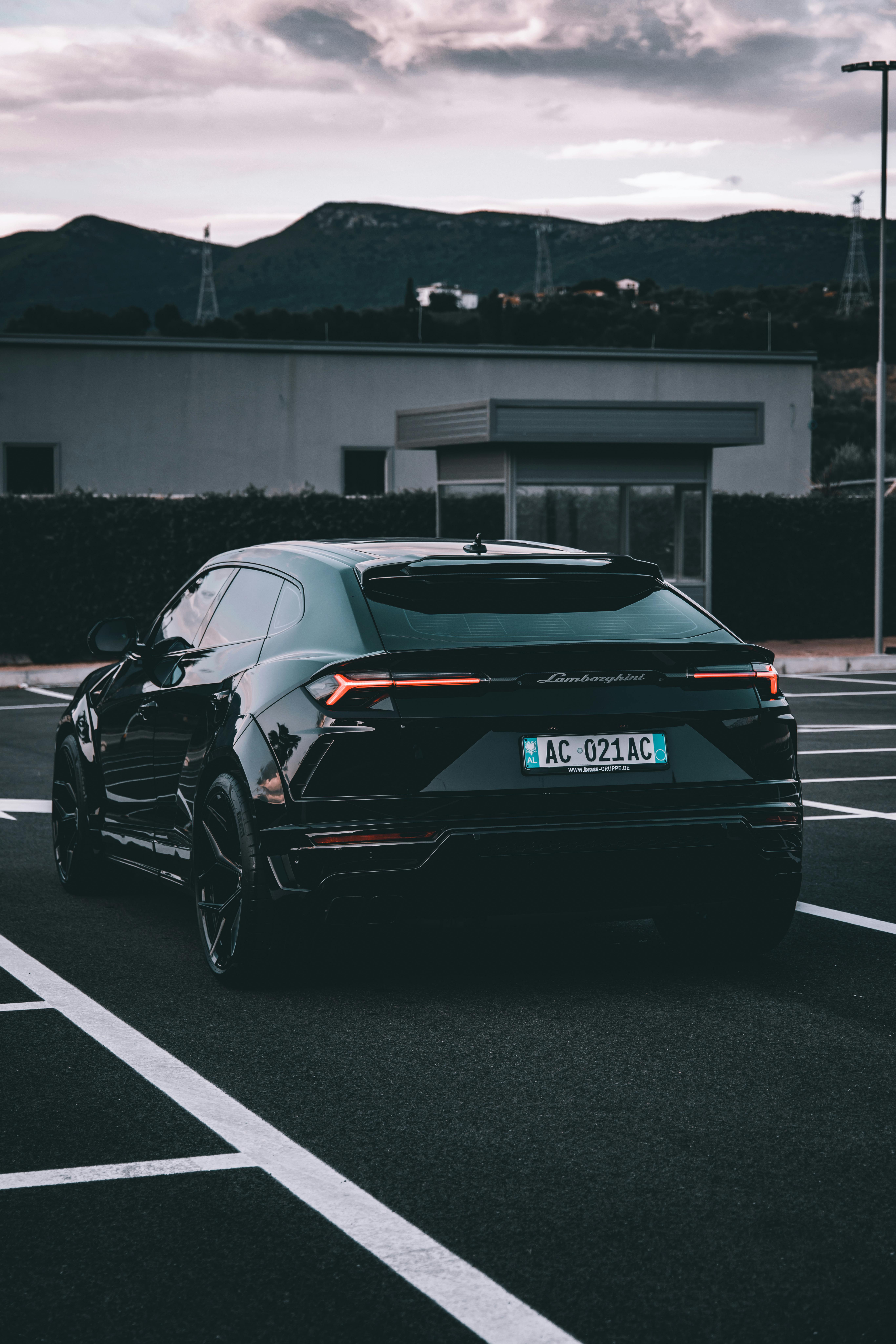 A Black Lamborghini Urus Driving on a Highway · Free Stock Photo