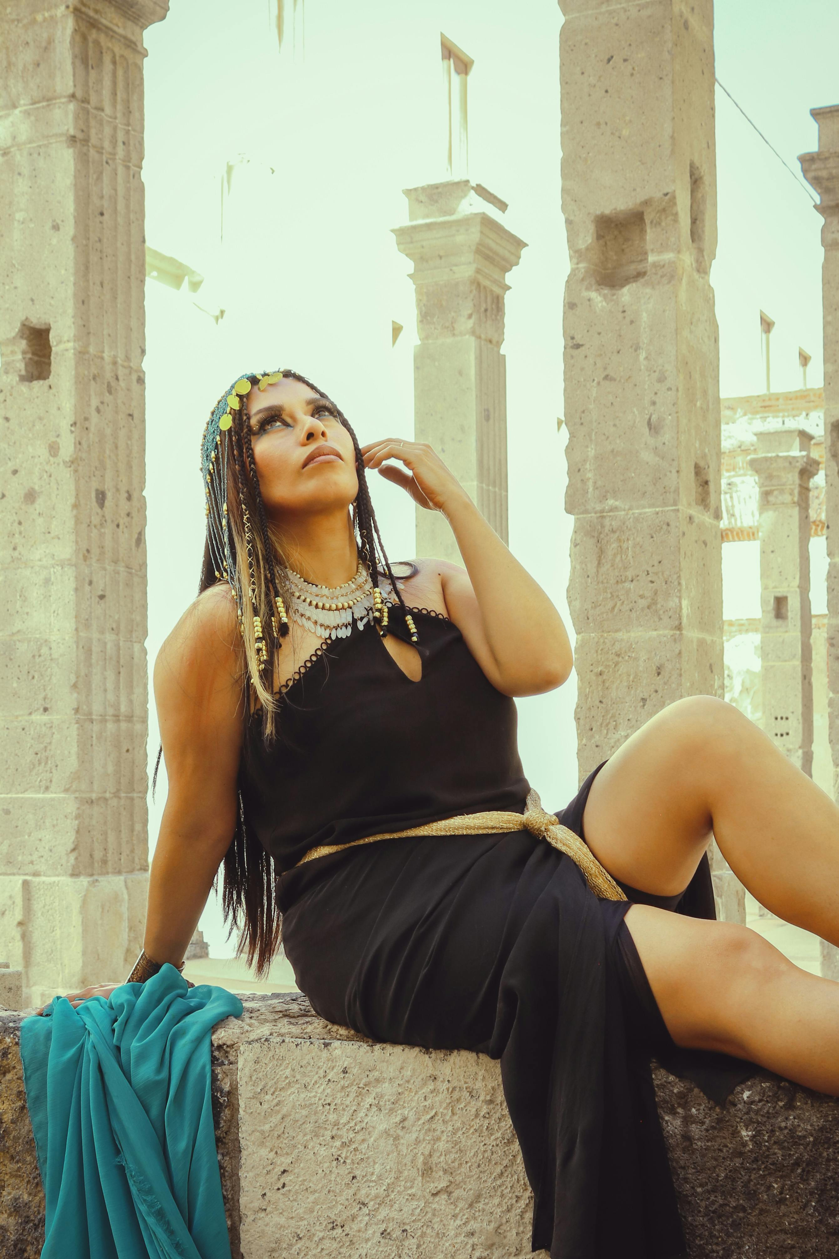 Woman Posing Among Columns · Free Stock Photo