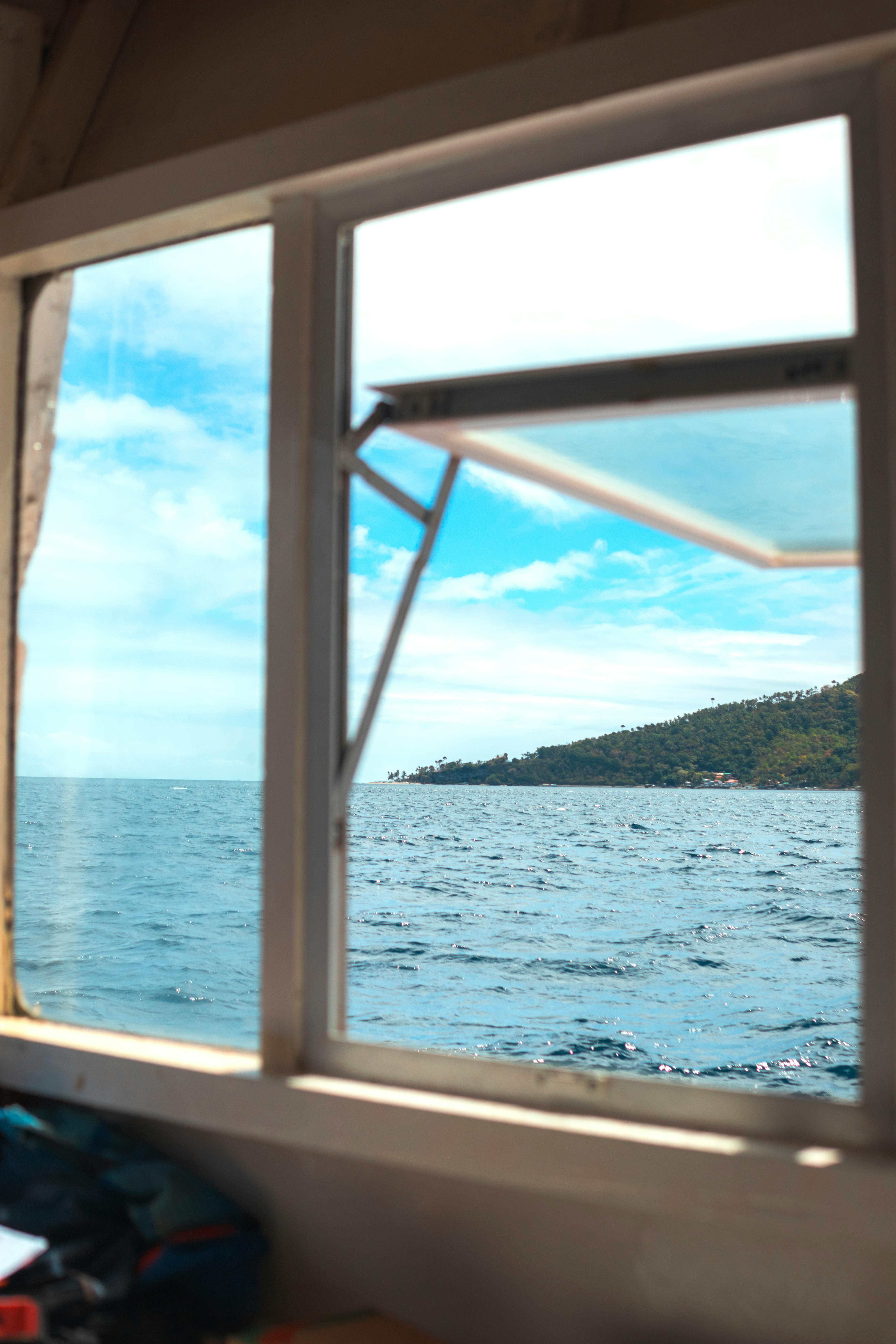 A view of the ocean from a boat window · Free Stock Photo