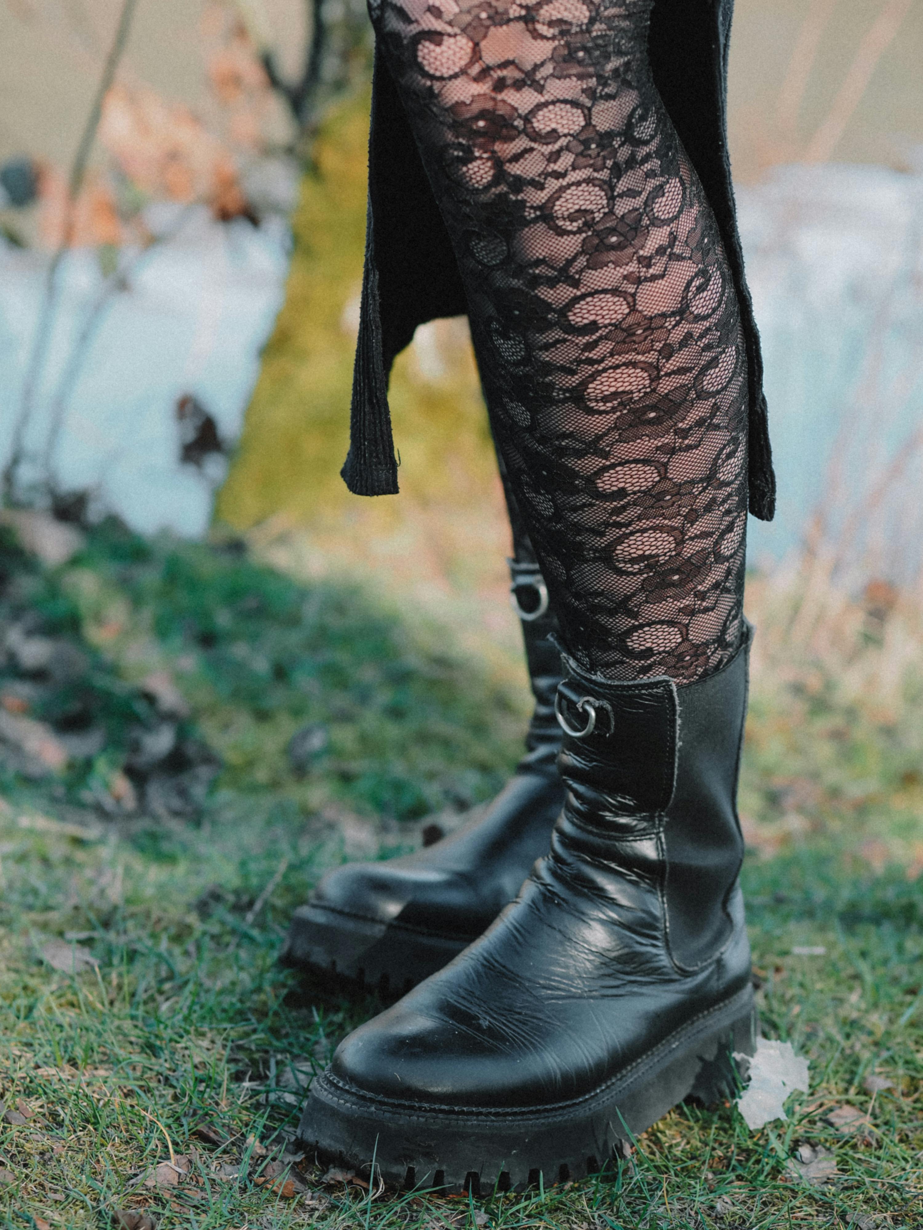 Legs in Black Stockings and Leather Boots · Free Stock Photo