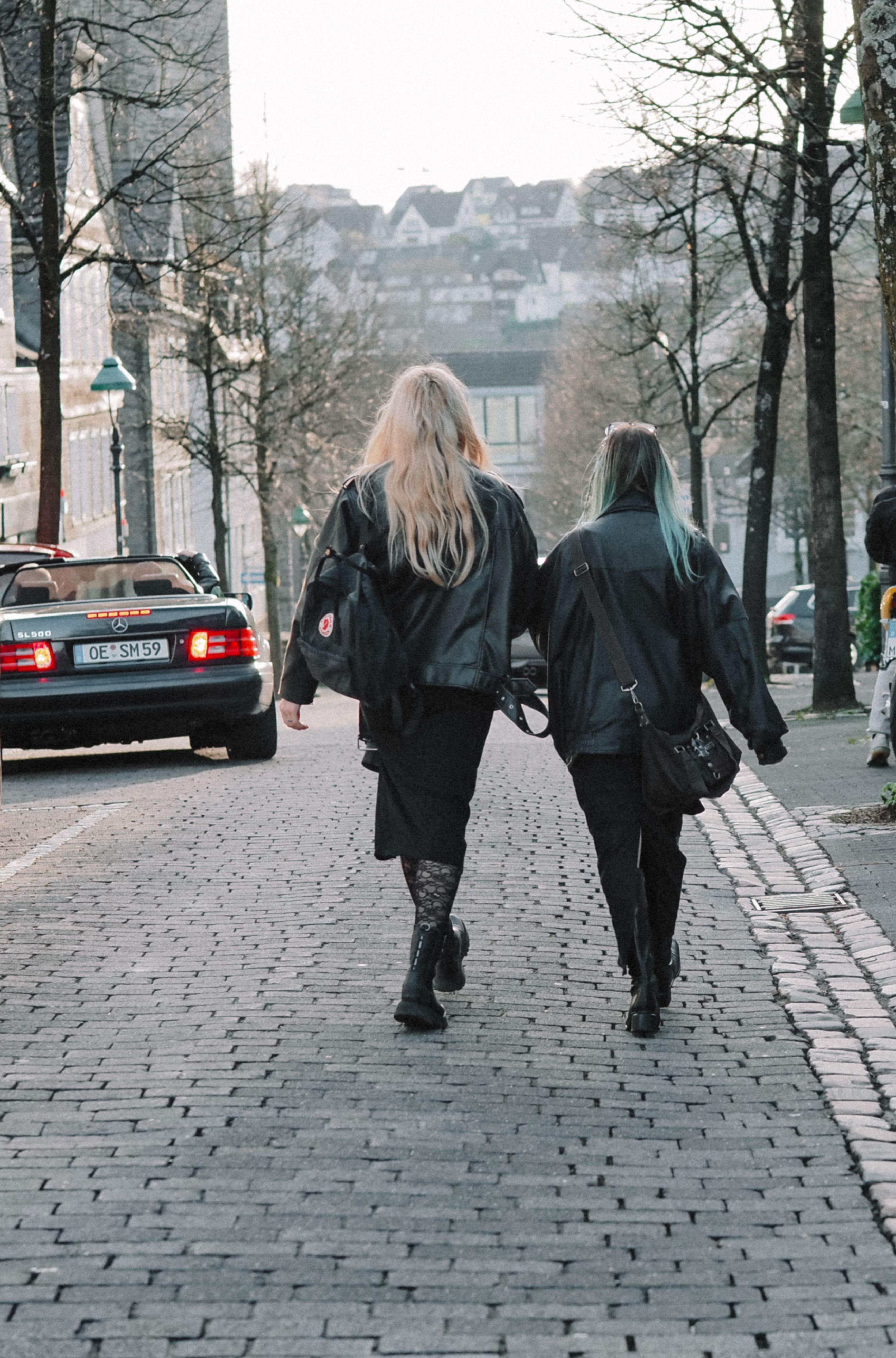 Back View of Two Girls Walking the Street · Free Stock Photo