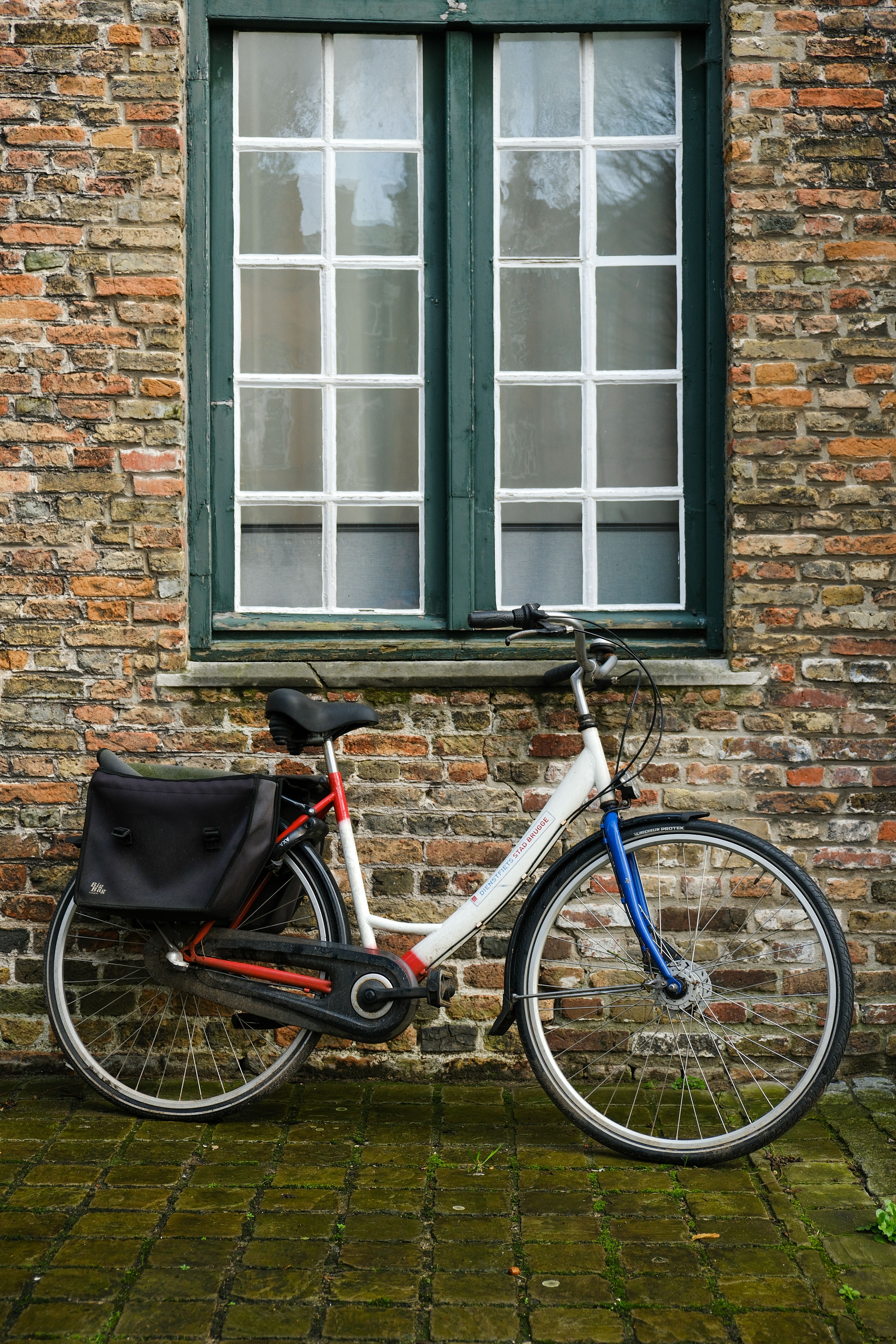 Retro Bike in Front of a Window of an Apartment Building · Free Stock Photo