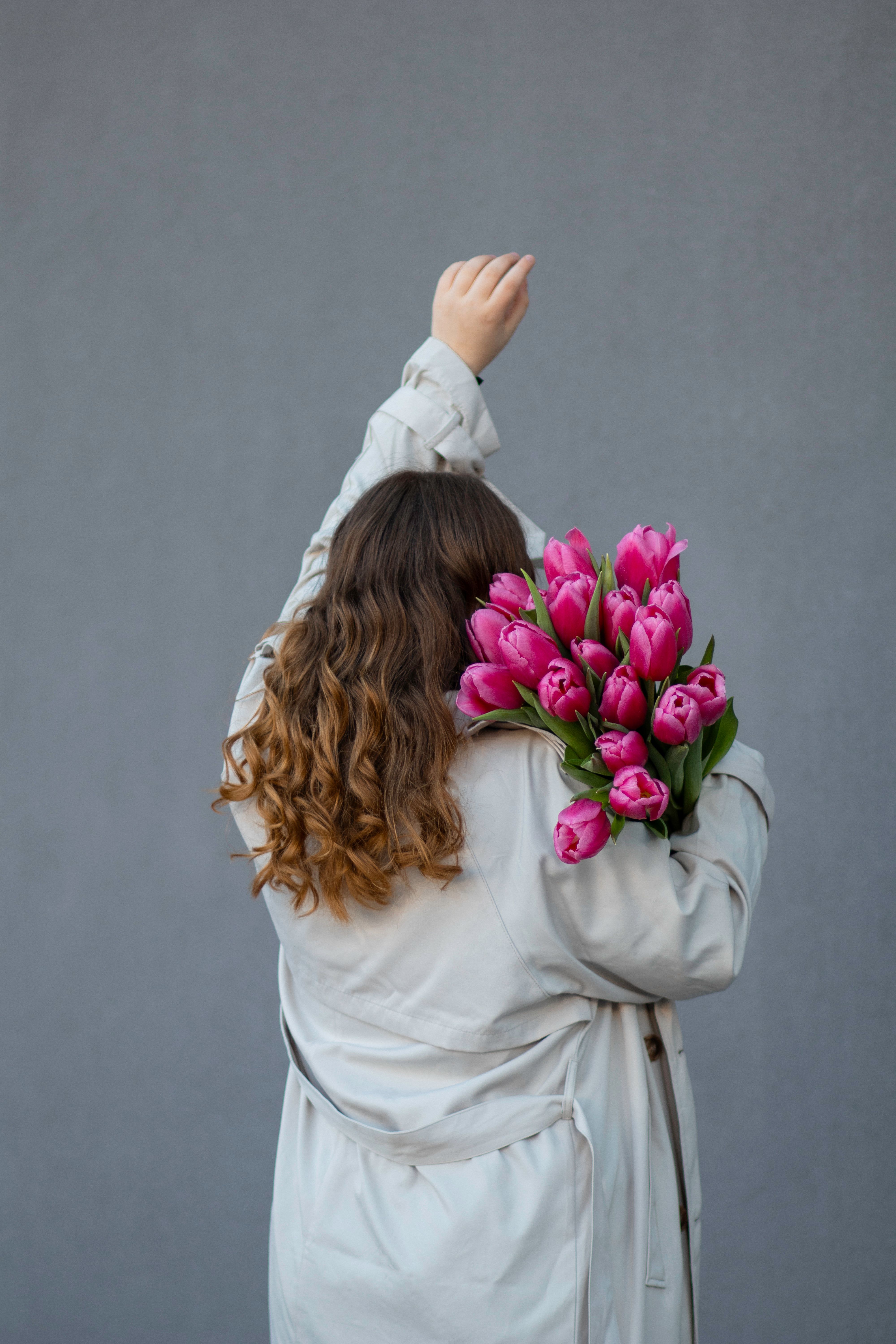 Back View of Woman with Pink Flowers · Free Stock Photo