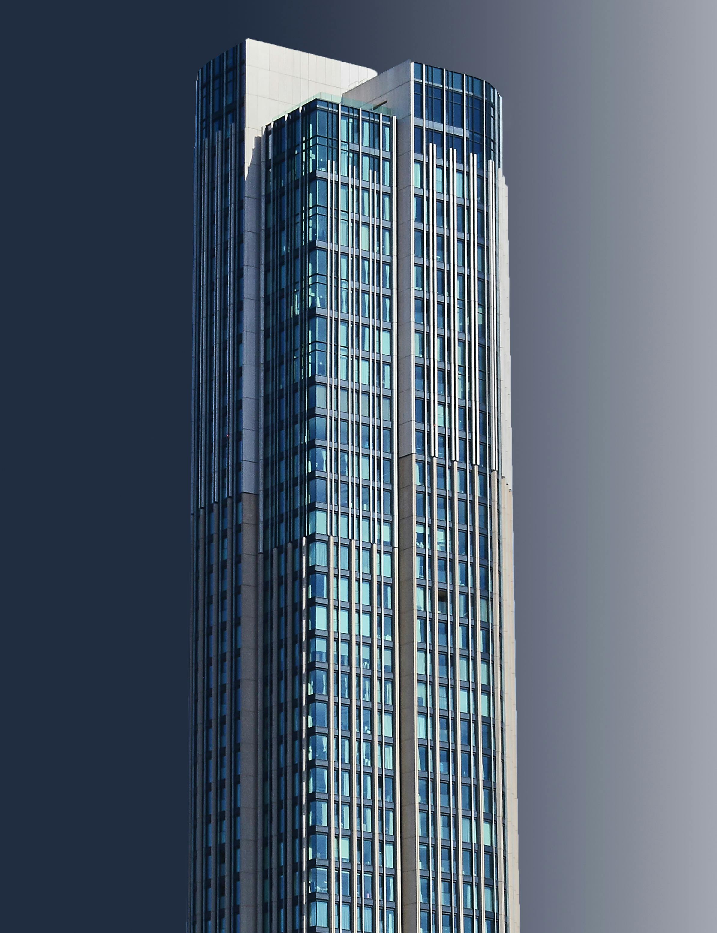 Glass Skyscraper against a Gray Sky · Free Stock Photo