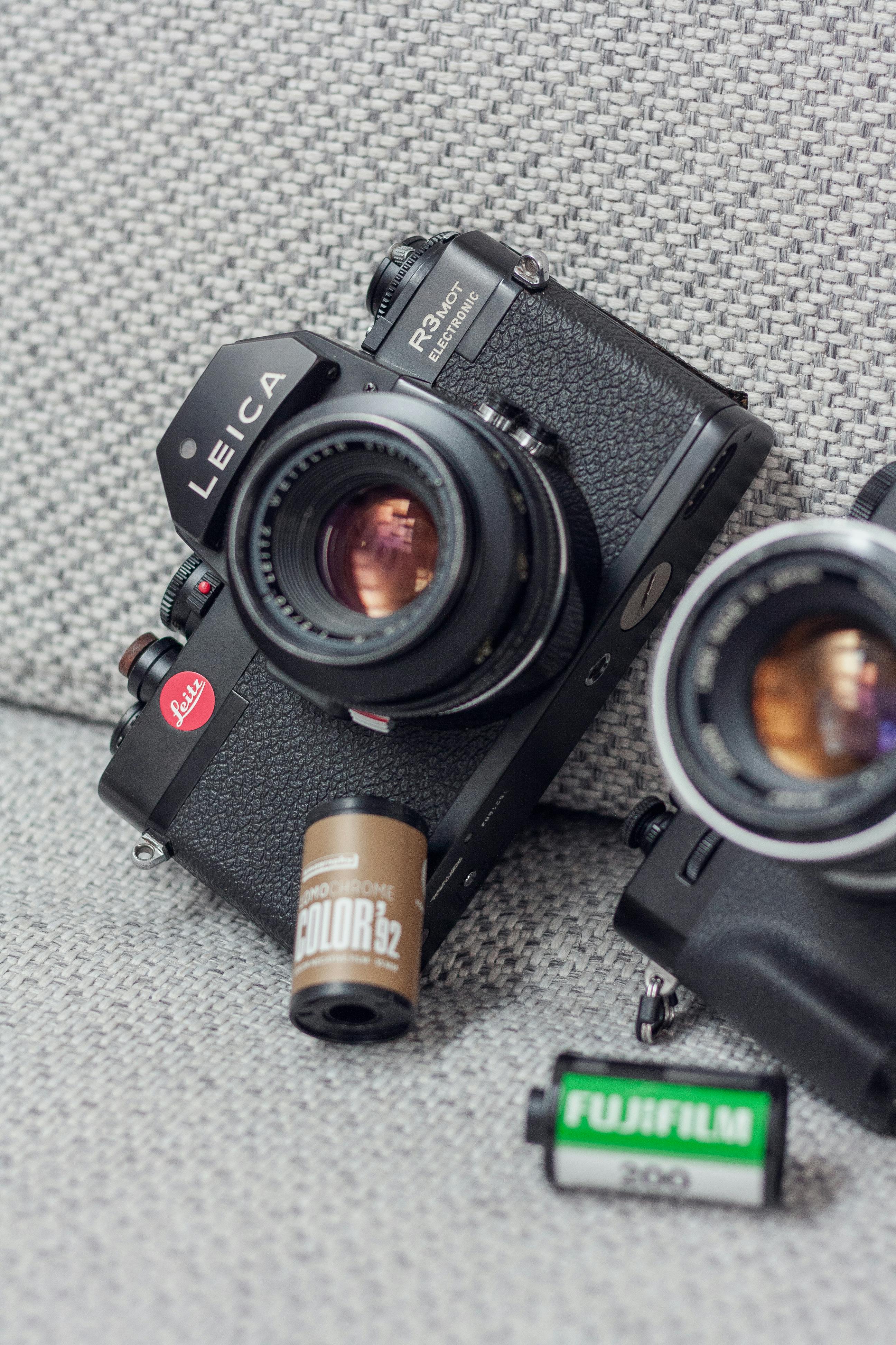 Camera On Black Folding Chair · Free Stock Photo
