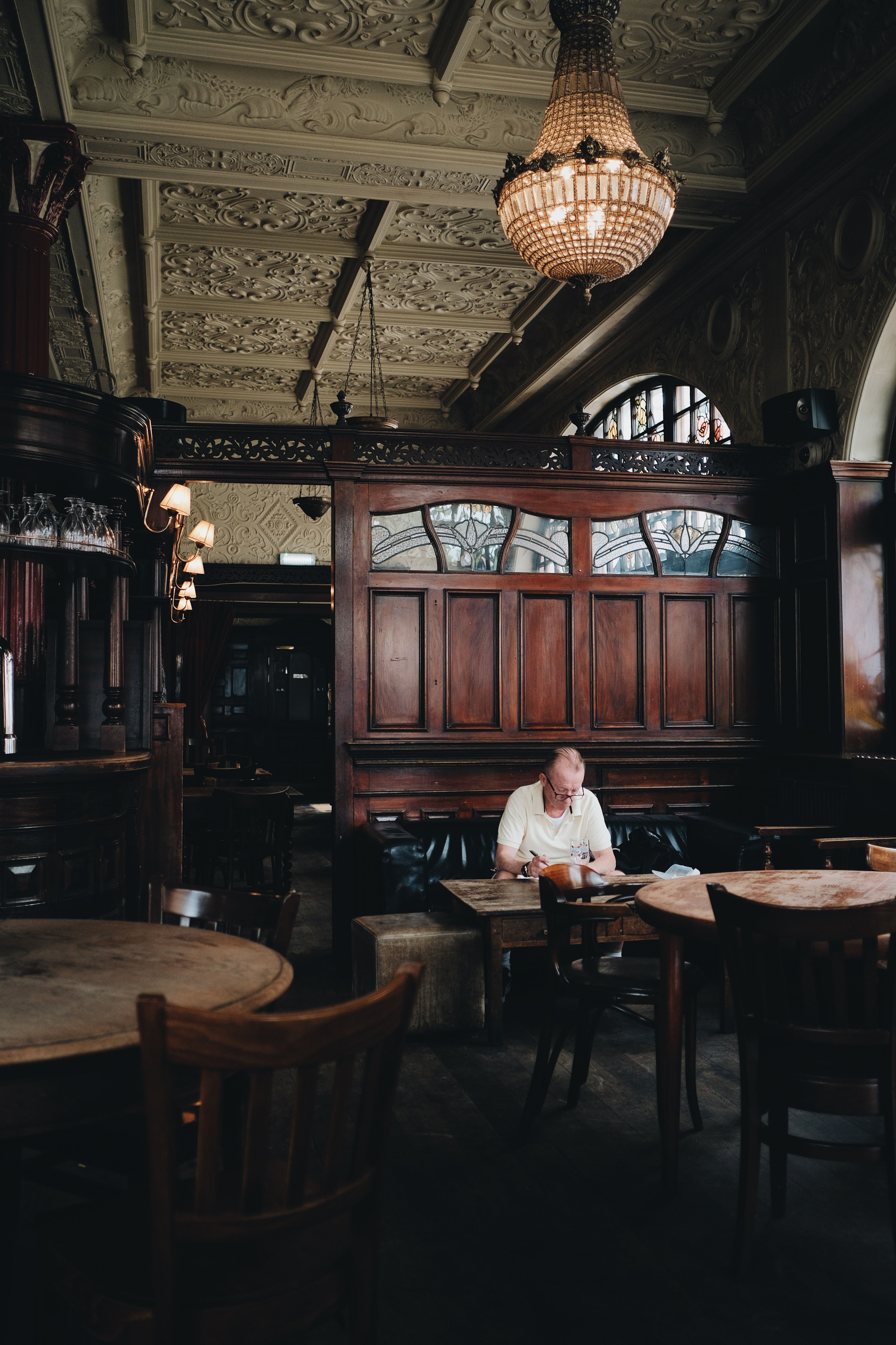Man Sits in Old-fashioned Pub · Free Stock Photo