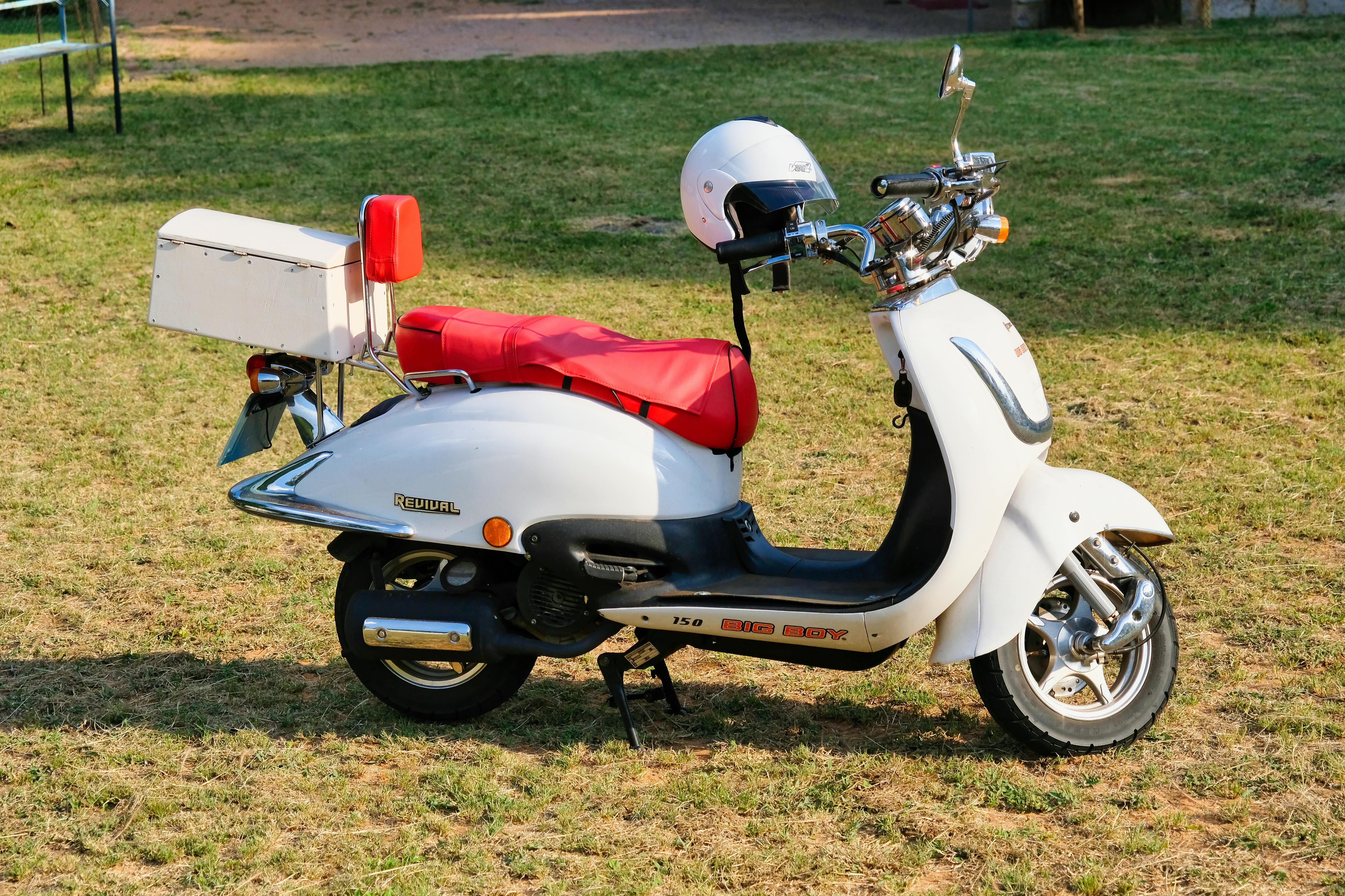 White Motor Scooter on Grass · Free Stock Photo