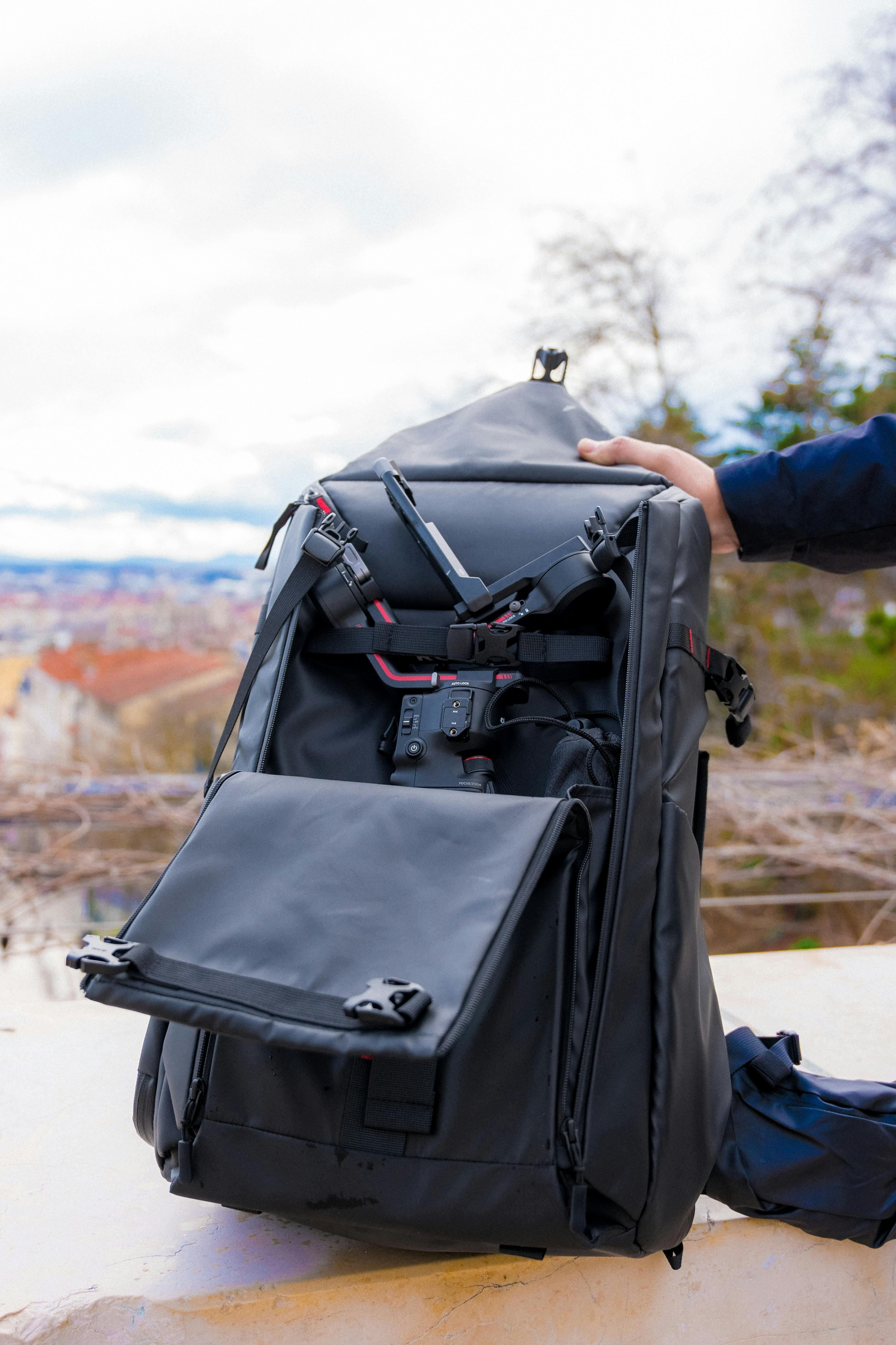 Man Holding Black Dslr Camera · Free Stock Photo