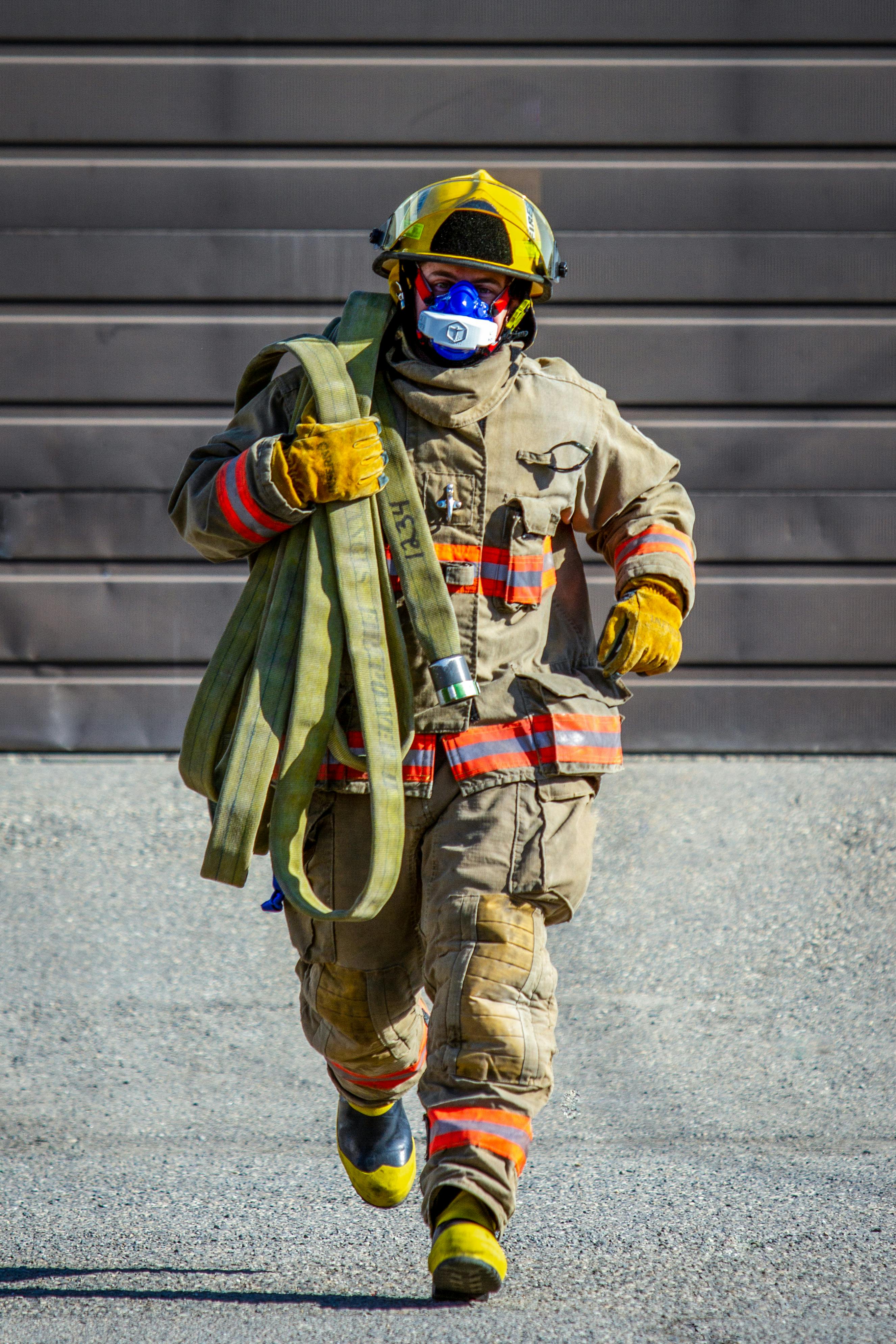 Photo of a Running Firefighter · Free Stock Photo