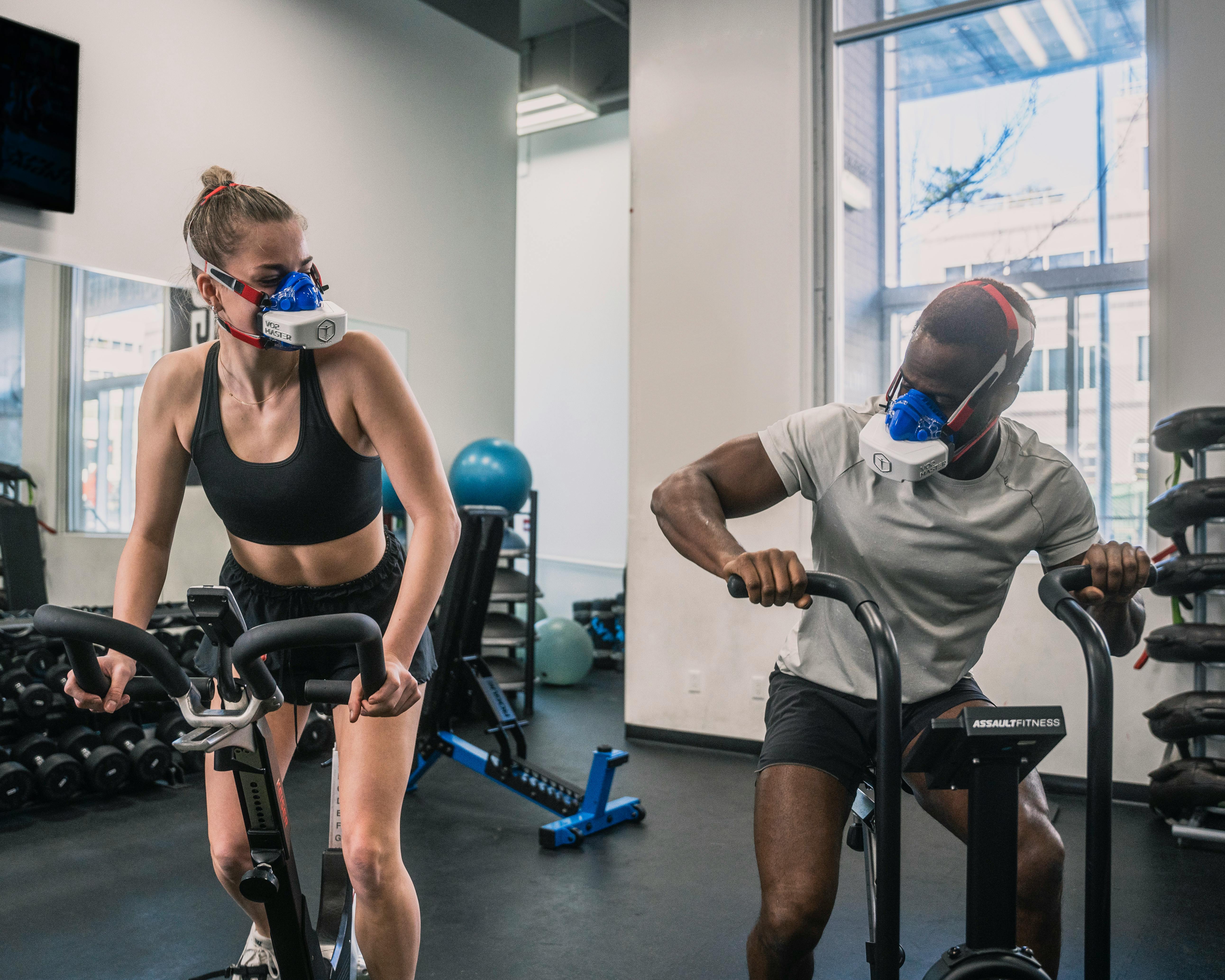 Two People Exercising in a Gym · Free Stock Photo