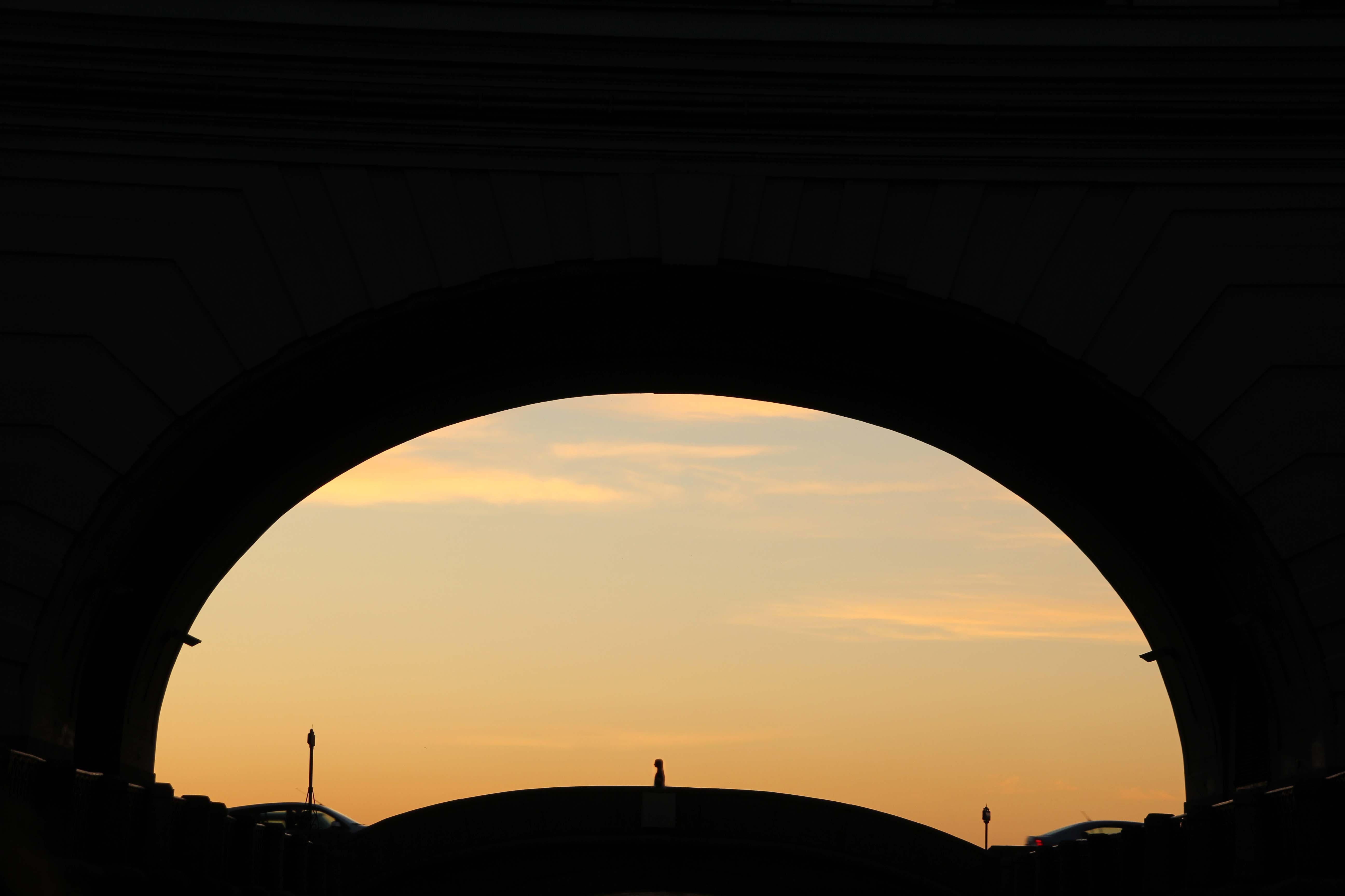 Silhouetted Arch of a Building against a Sunset Sky · Free Stock Photo