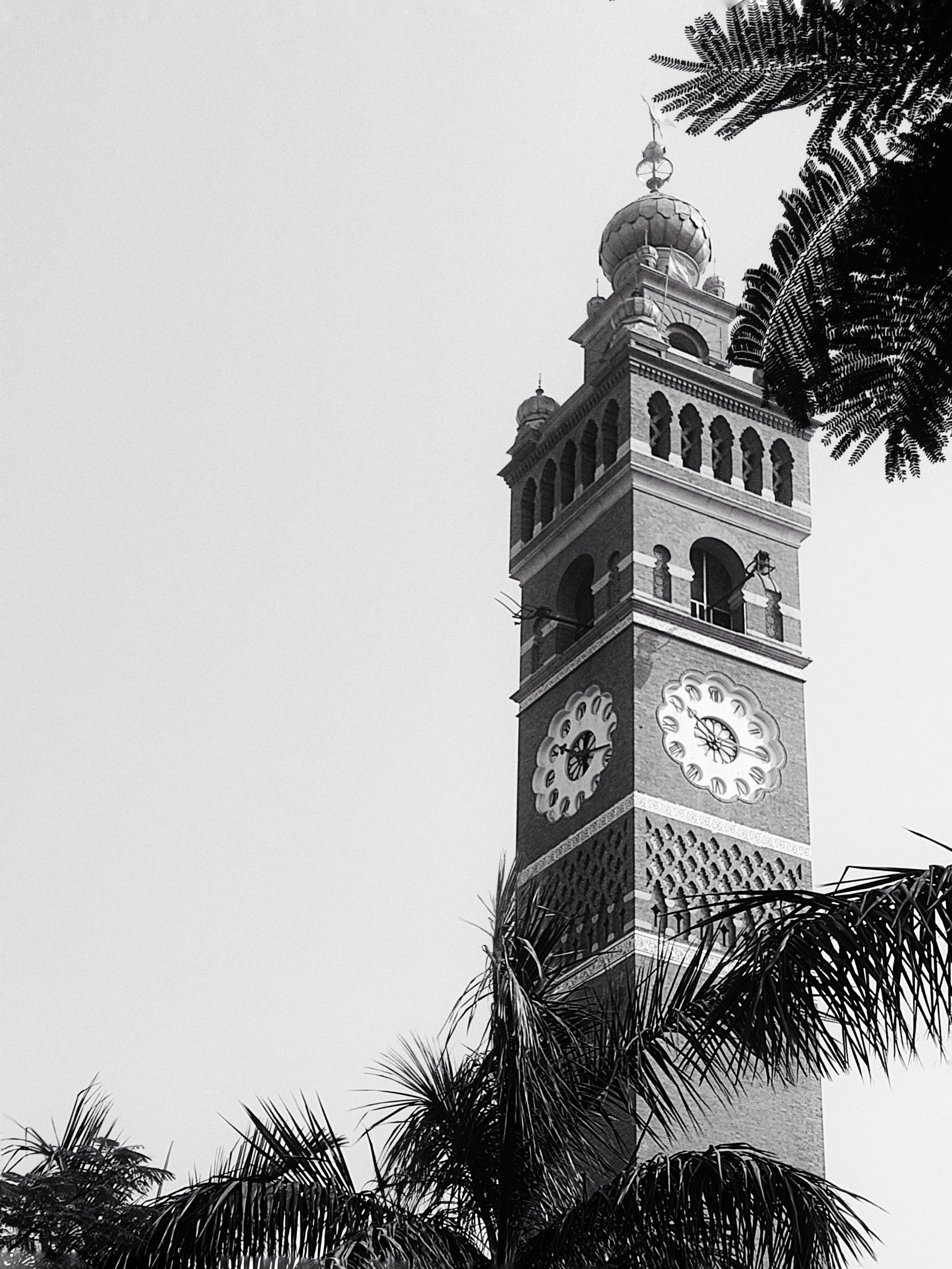 A black and white photo of a clock tower · Free Stock Photo