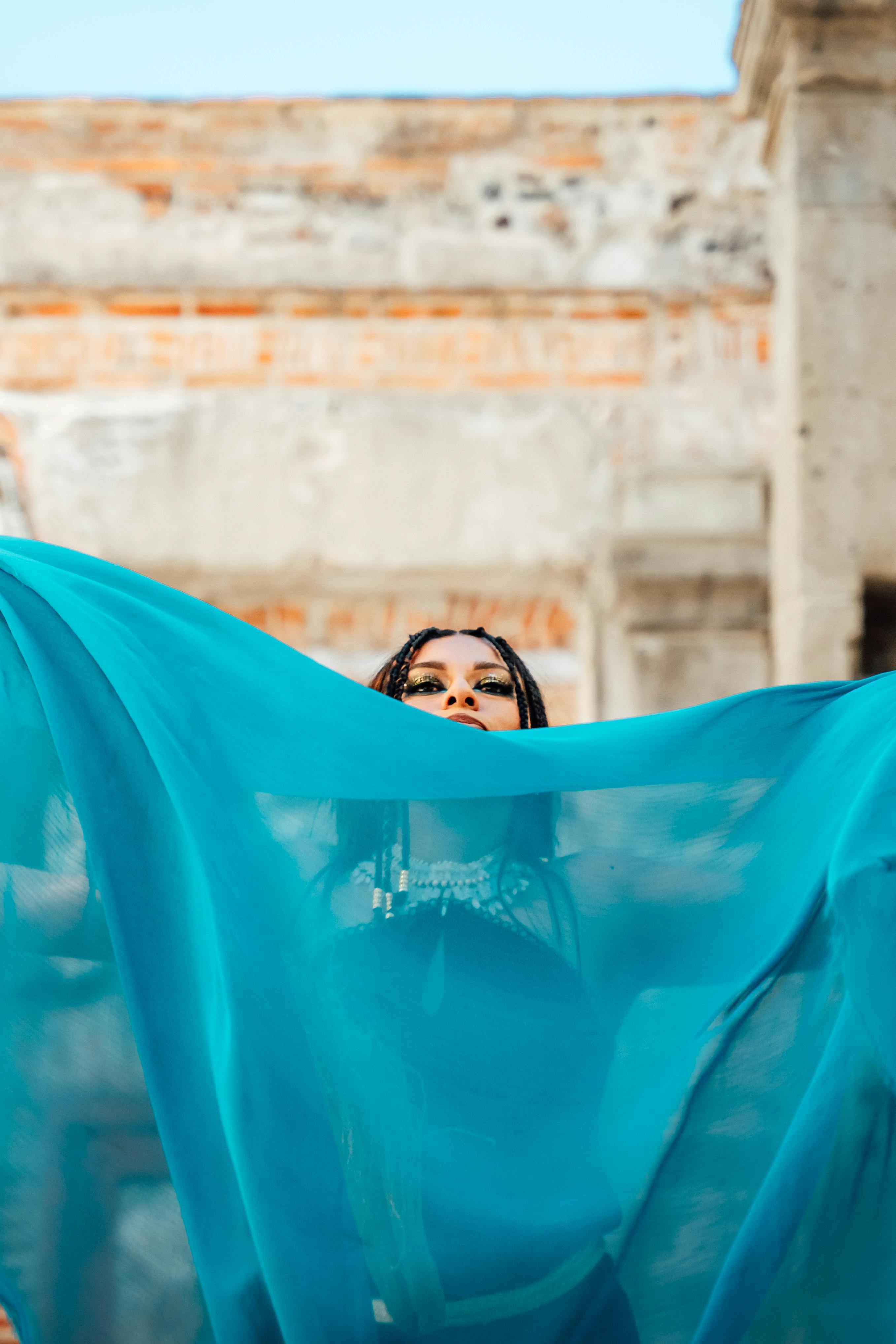 Woman Throwing Blue Fabric in Air · Free Stock Photo