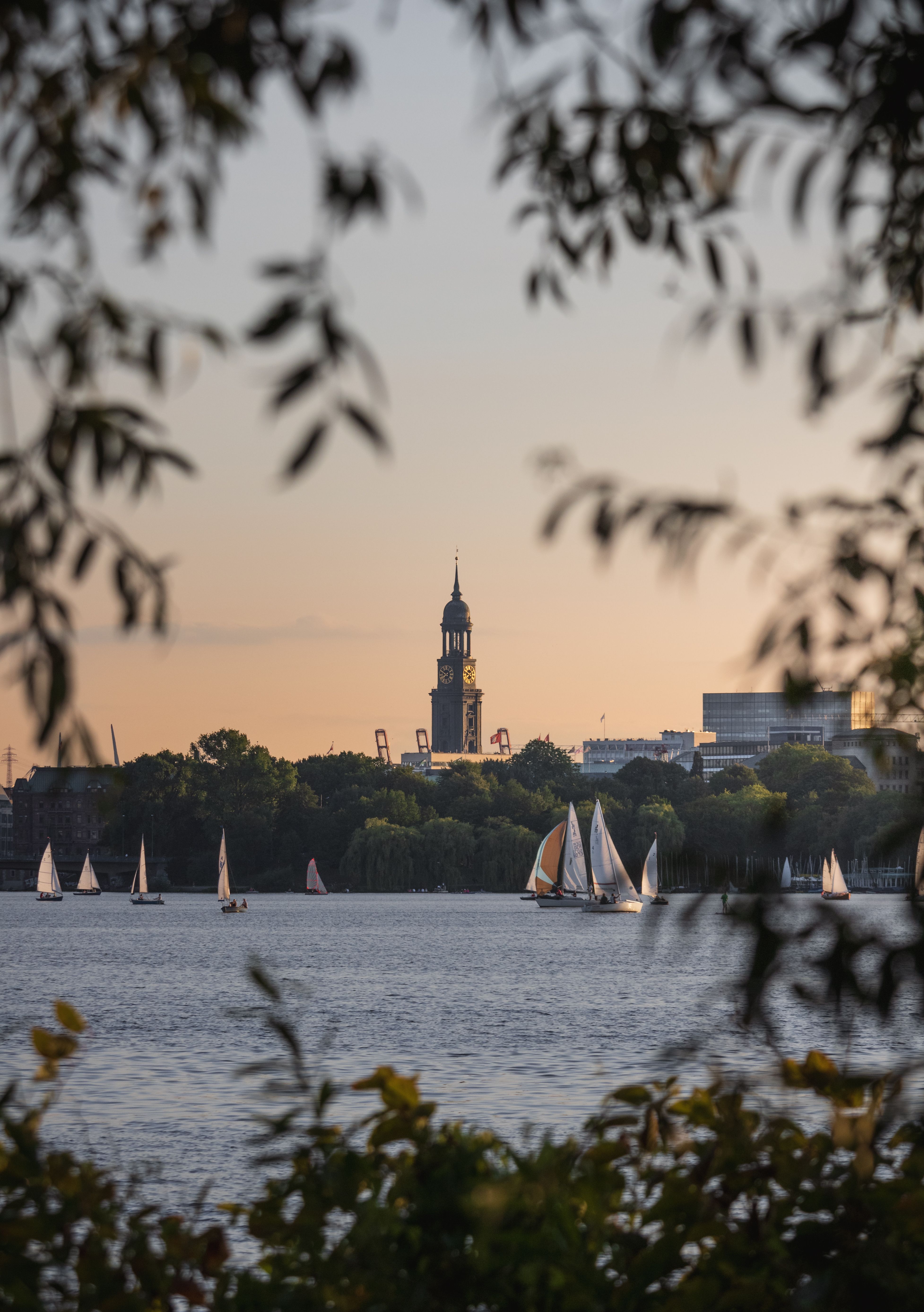 View of Sailboats on the Alster Lake and the St. Michaels Church Tower ...