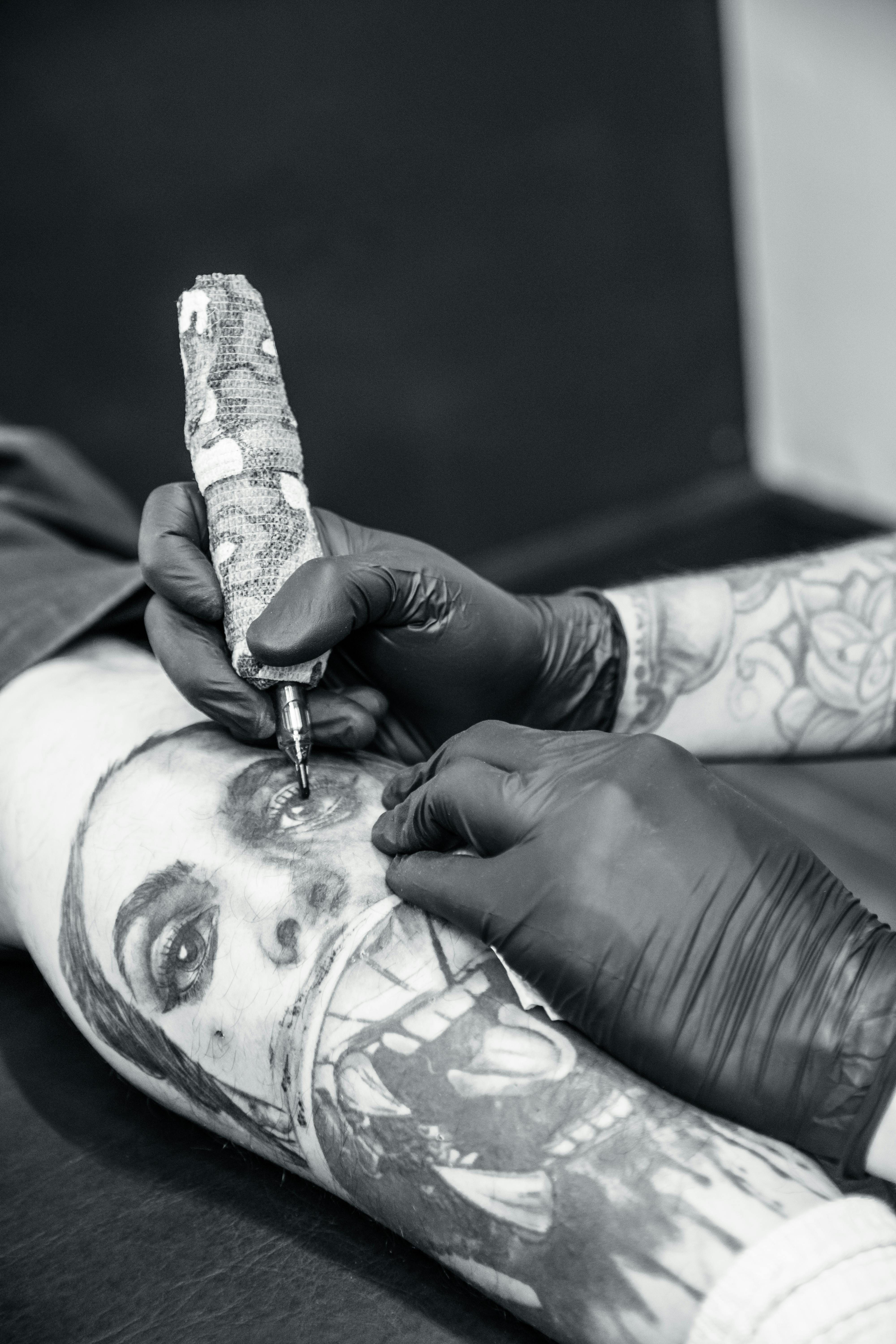 Person Doing Tattoo Session · Free Stock Photo