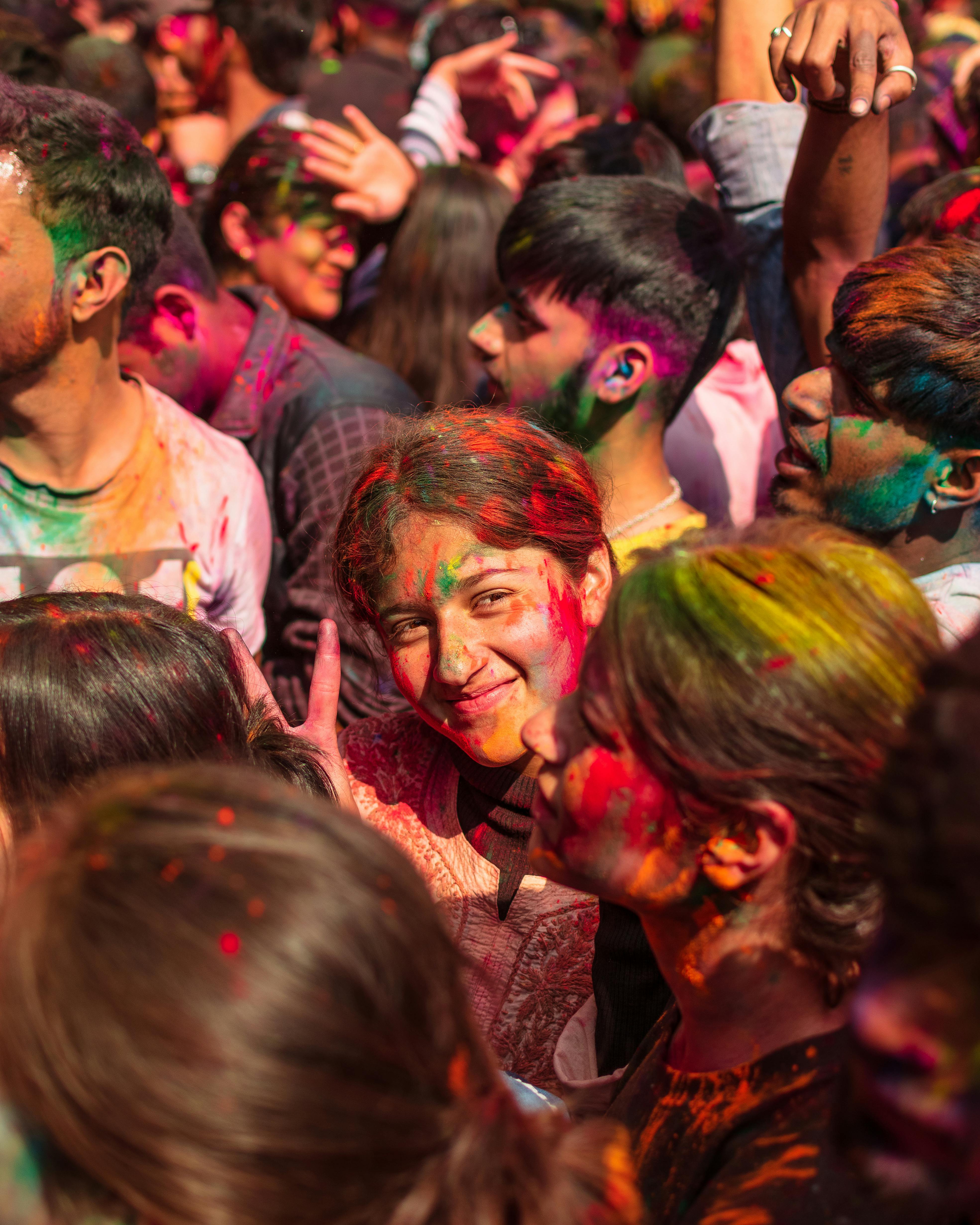 Smiling Woman in Crowd at Festival · Free Stock Photo