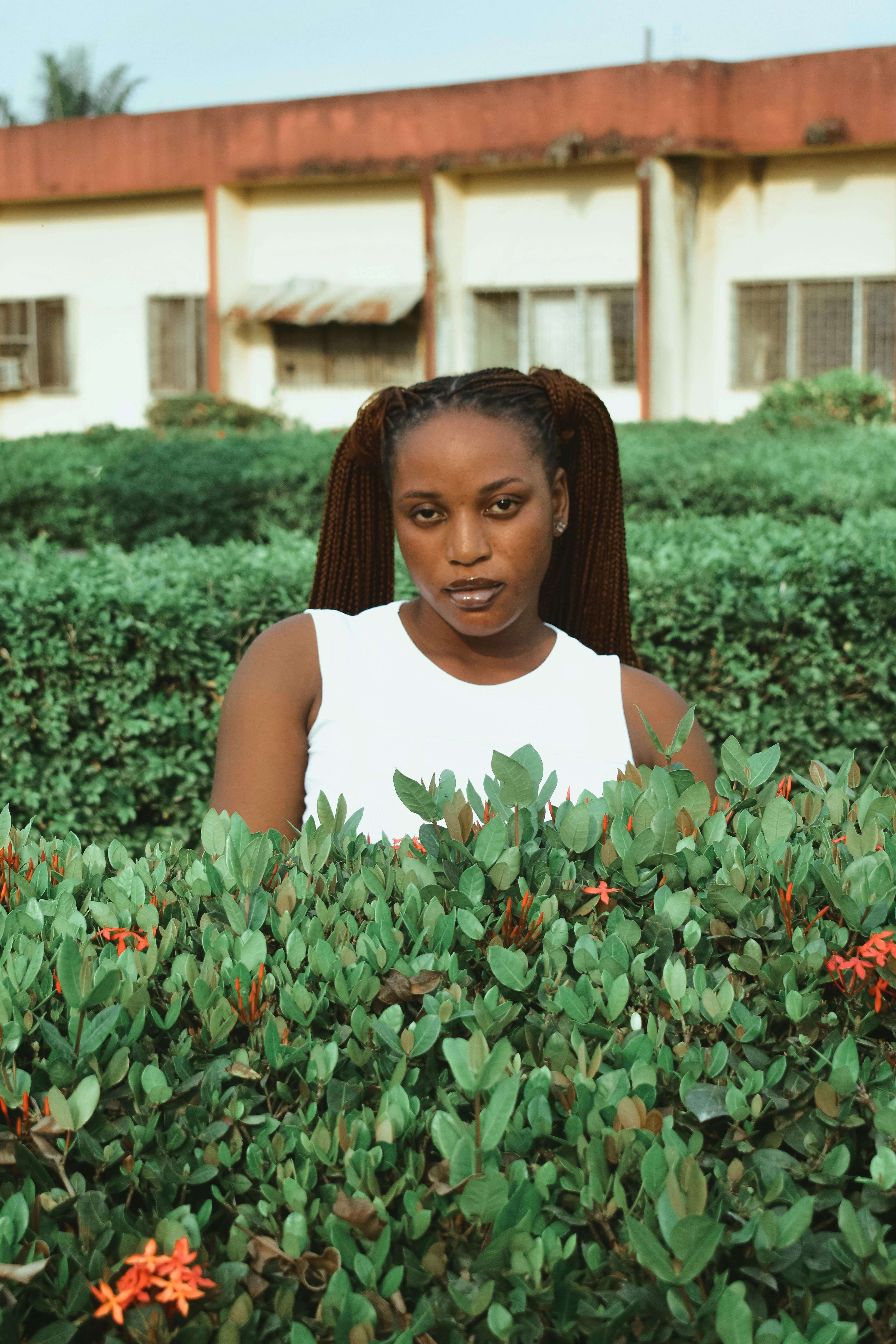 Portrait of Woman in Hedge · Free Stock Photo