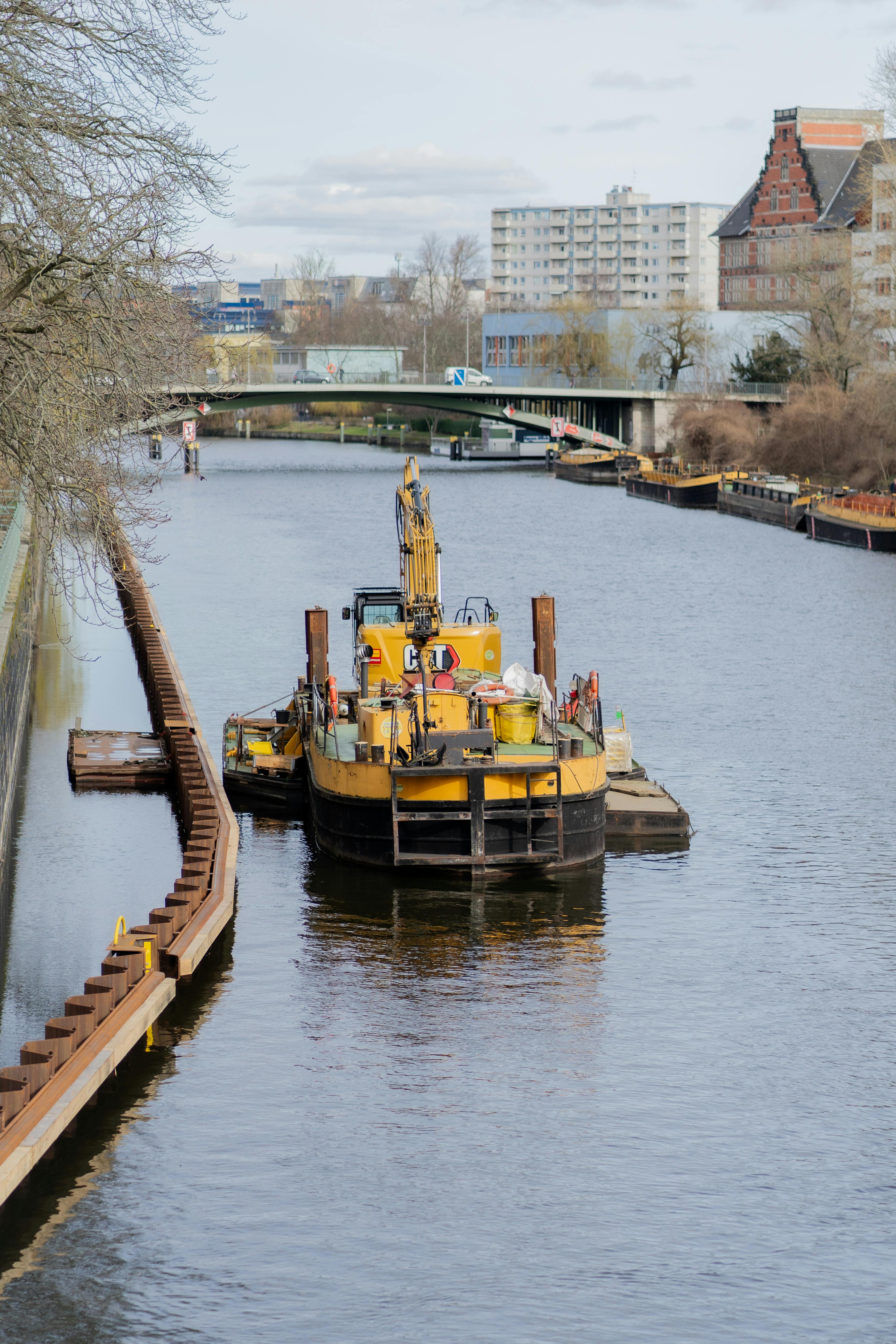 Barge Moored on River in City · Free Stock Photo