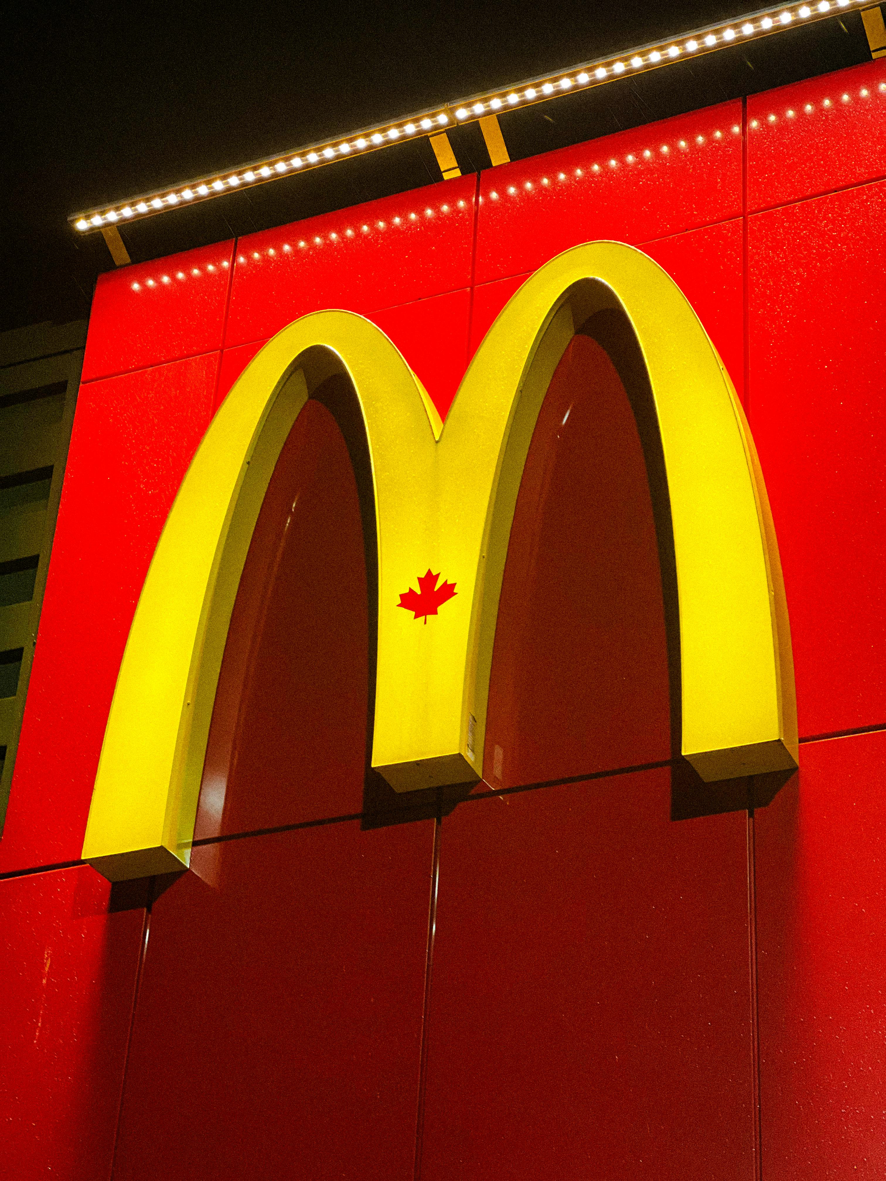 Canadian Maple Leaf on Wall with McDonalds Logo · Free Stock Photo