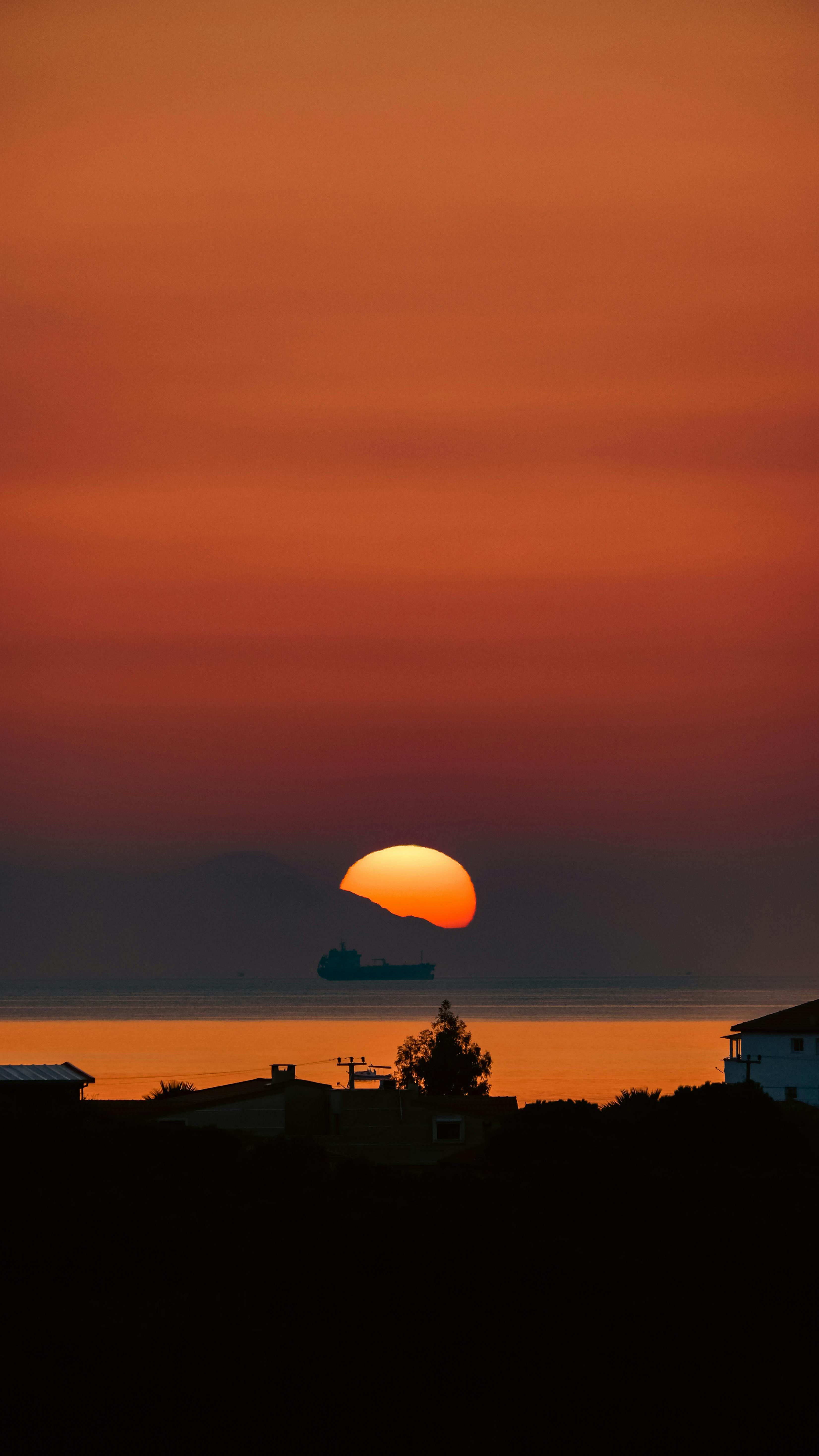 Sunset Over A Body Of Water · Free Stock Photo