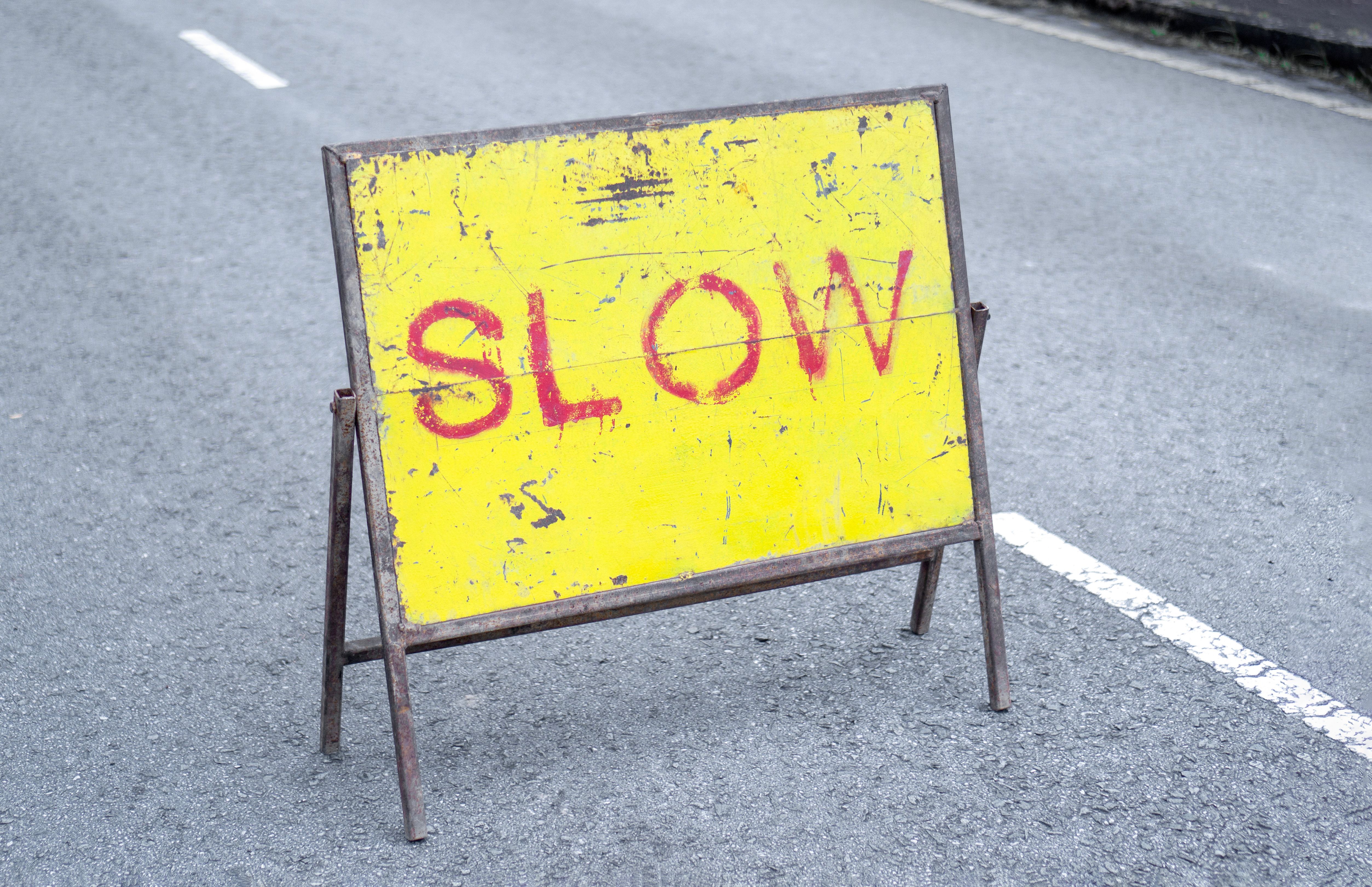 Slow Road Works Sign · Free Stock Photo